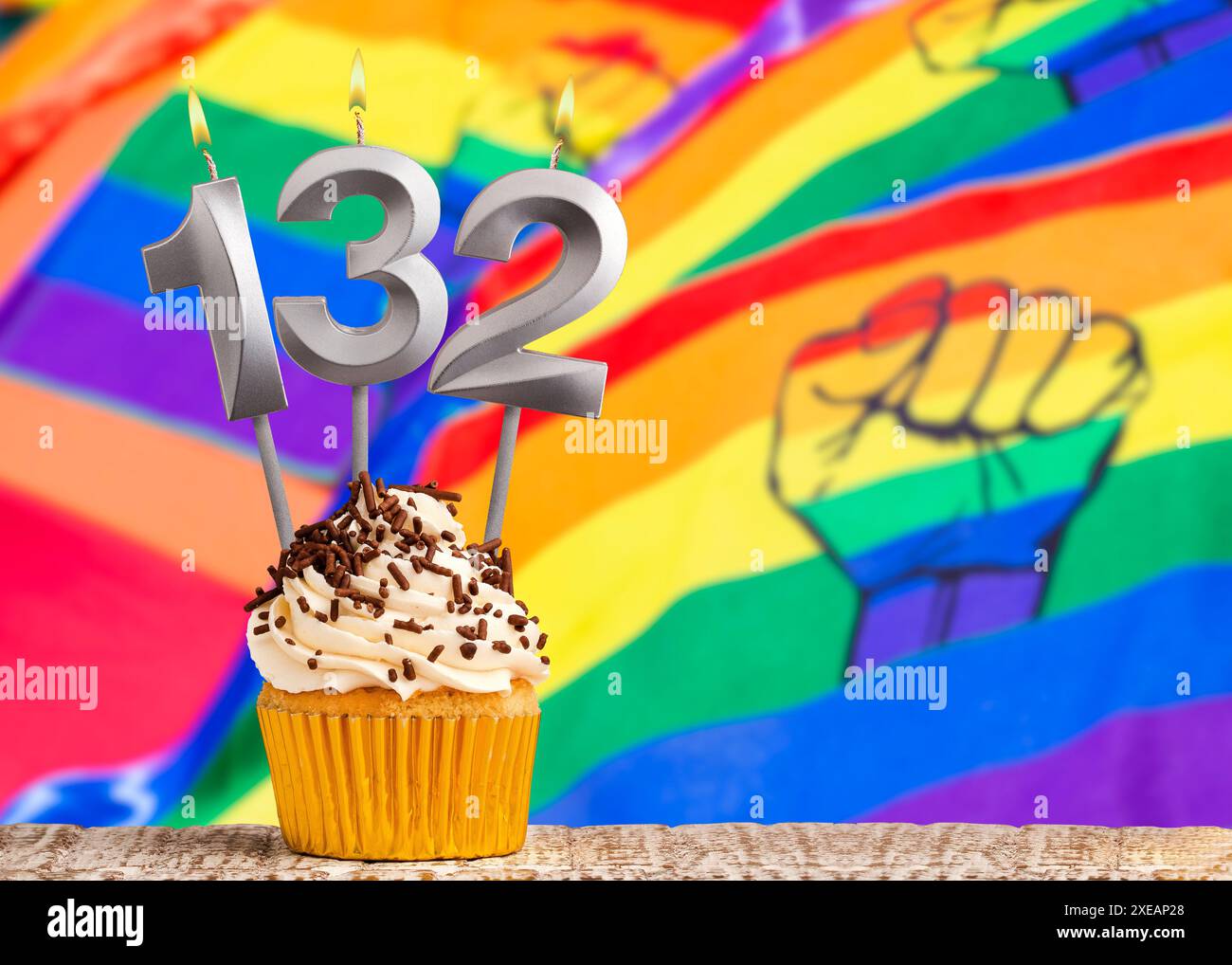 Birthday candle number 132 - Gay march flag background Stock Photo - Alamy