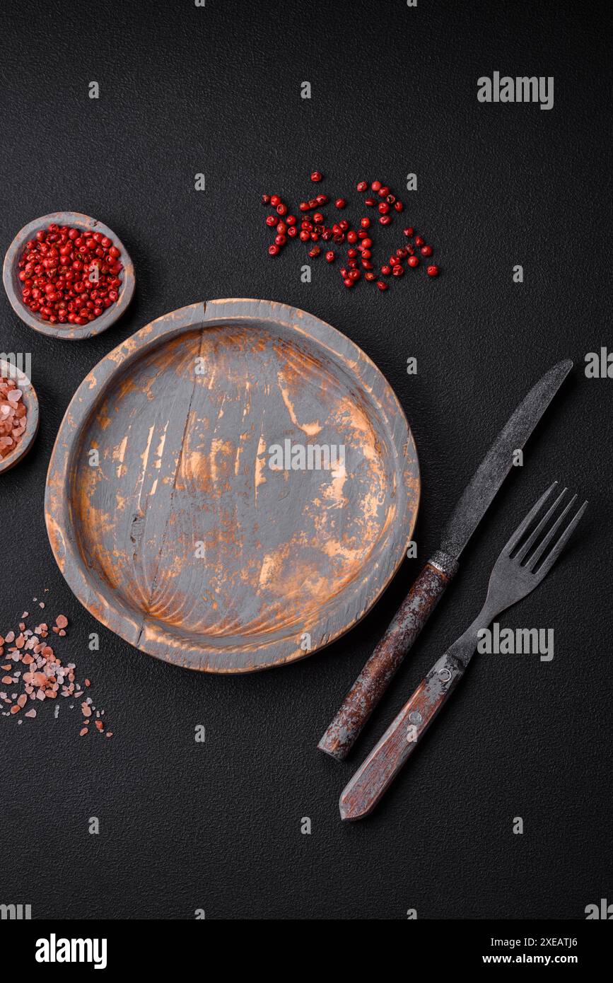 Empty wooden plate, knife, fork and cutting board Stock Photo - Alamy