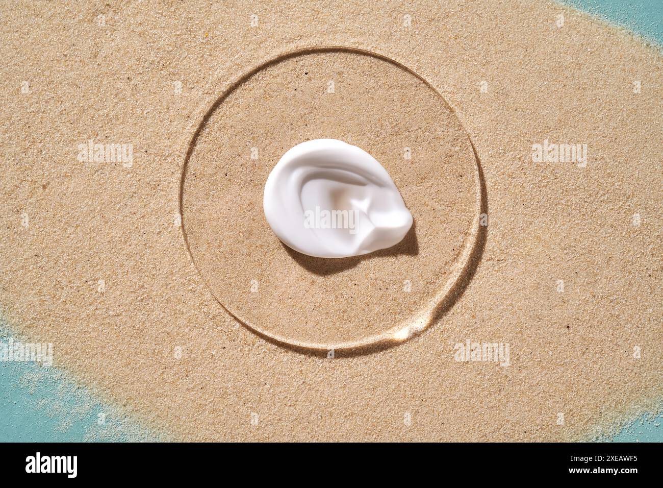 A smear of white sunscreen with SPF against a background of sand Stock ...