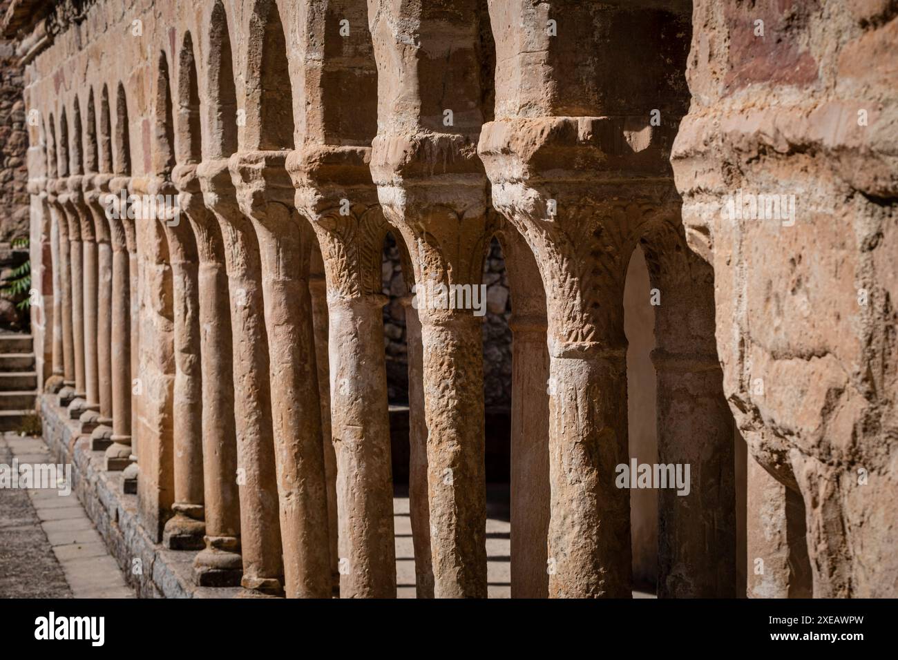 Arcaded gallery of semicircular arches on paired columns Stock Photo - Alamy
