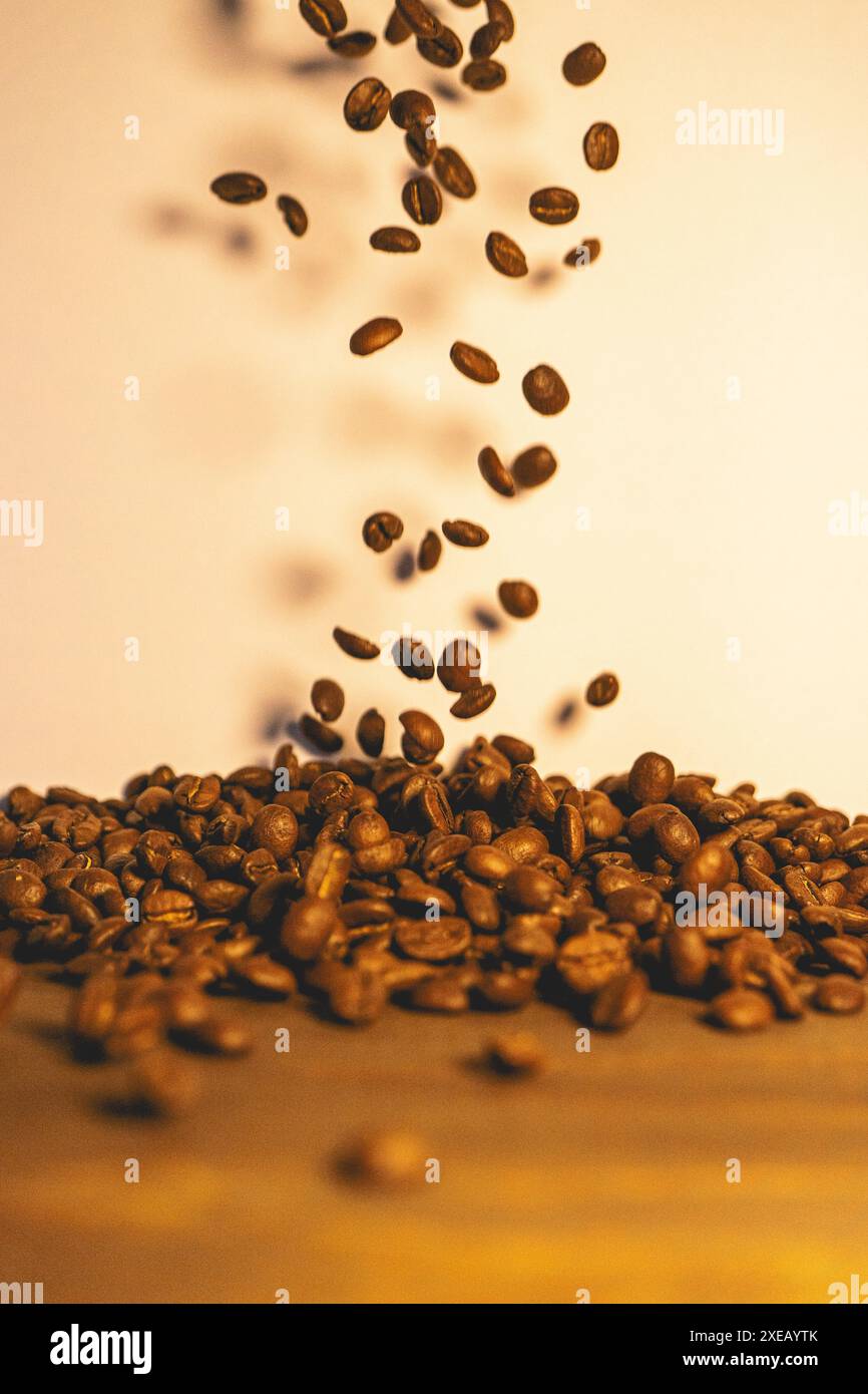 Many coffee roasted beans falling hi-res stock photography and images ...