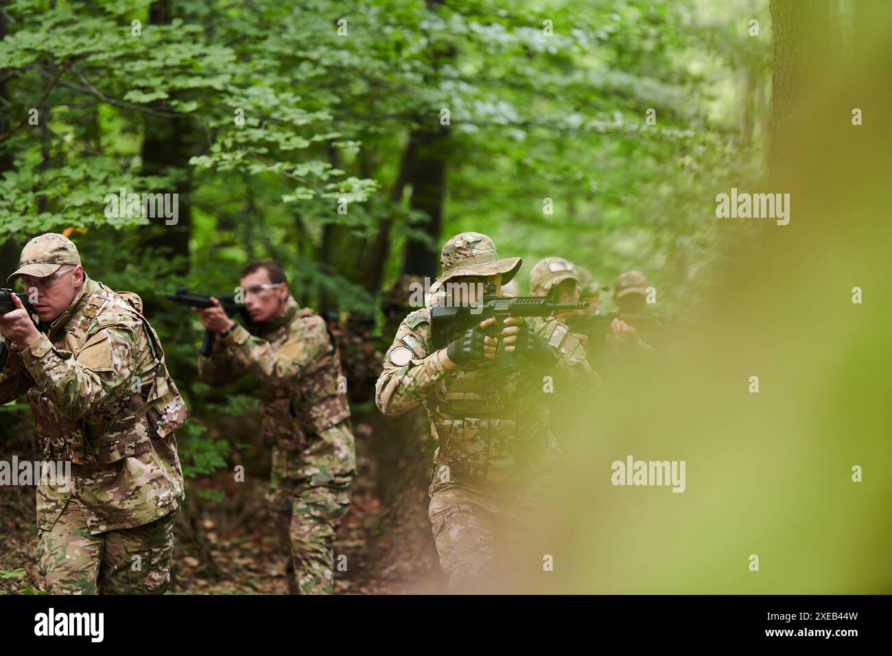 A disciplined and specialized military unit, donned in camouflage ...