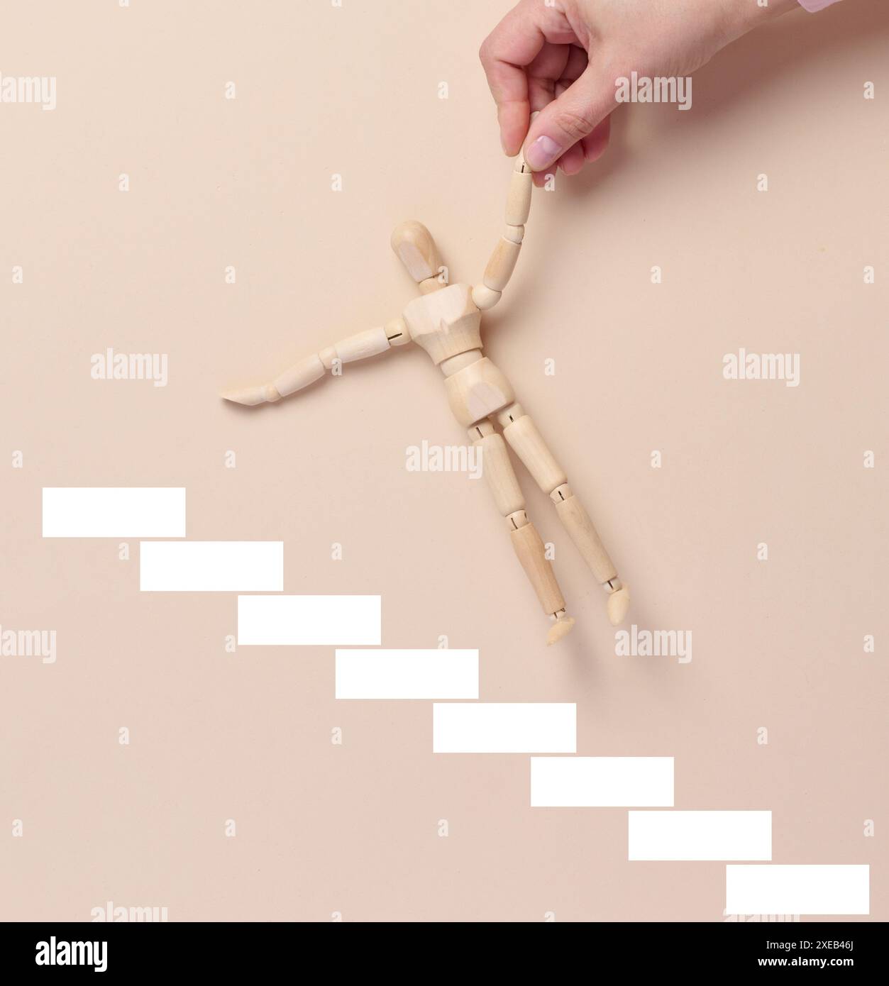 Steps and a woman's hand holding figurines, the concept of career ...