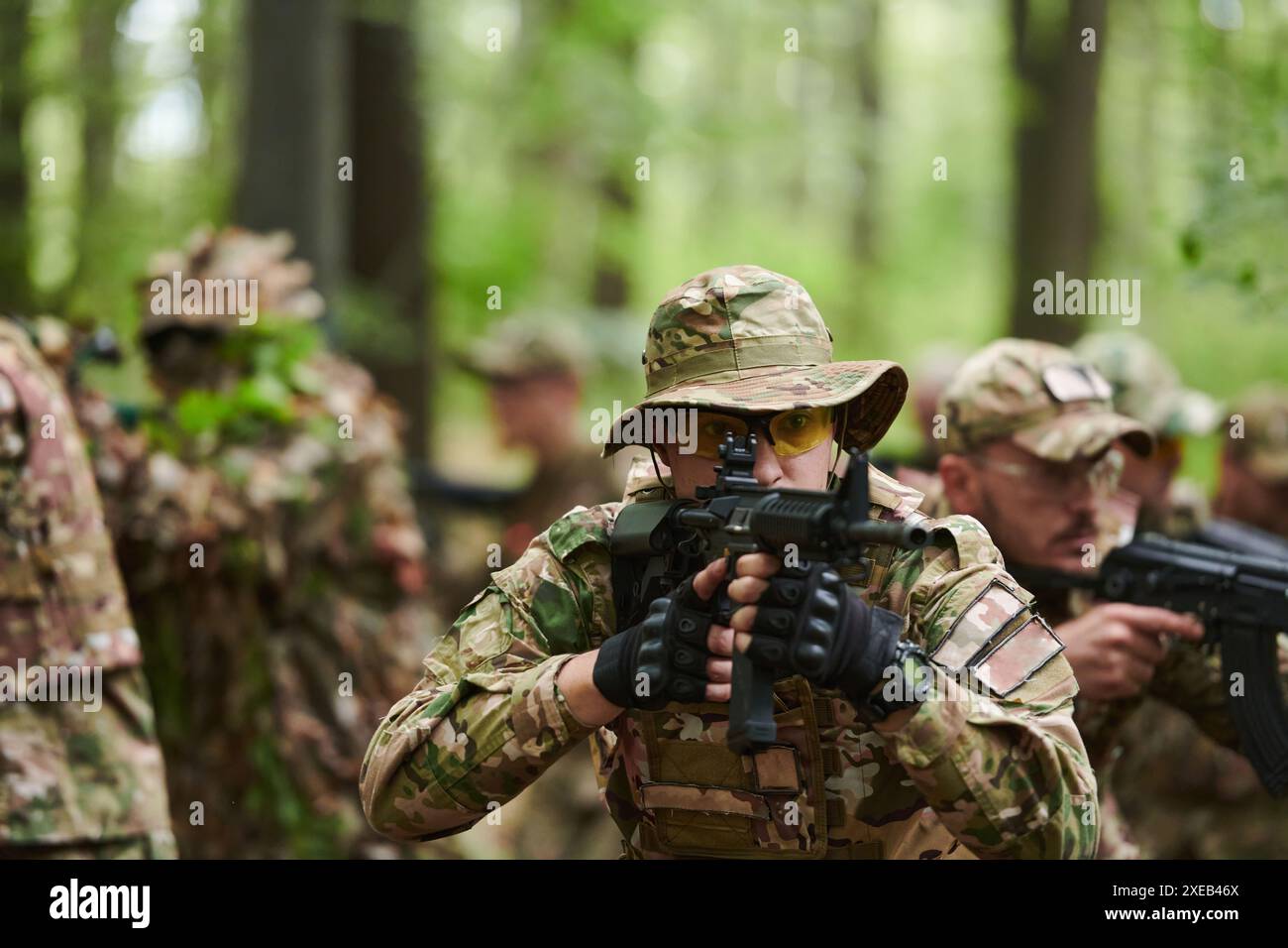 A disciplined and specialized military unit, donned in camouflage ...