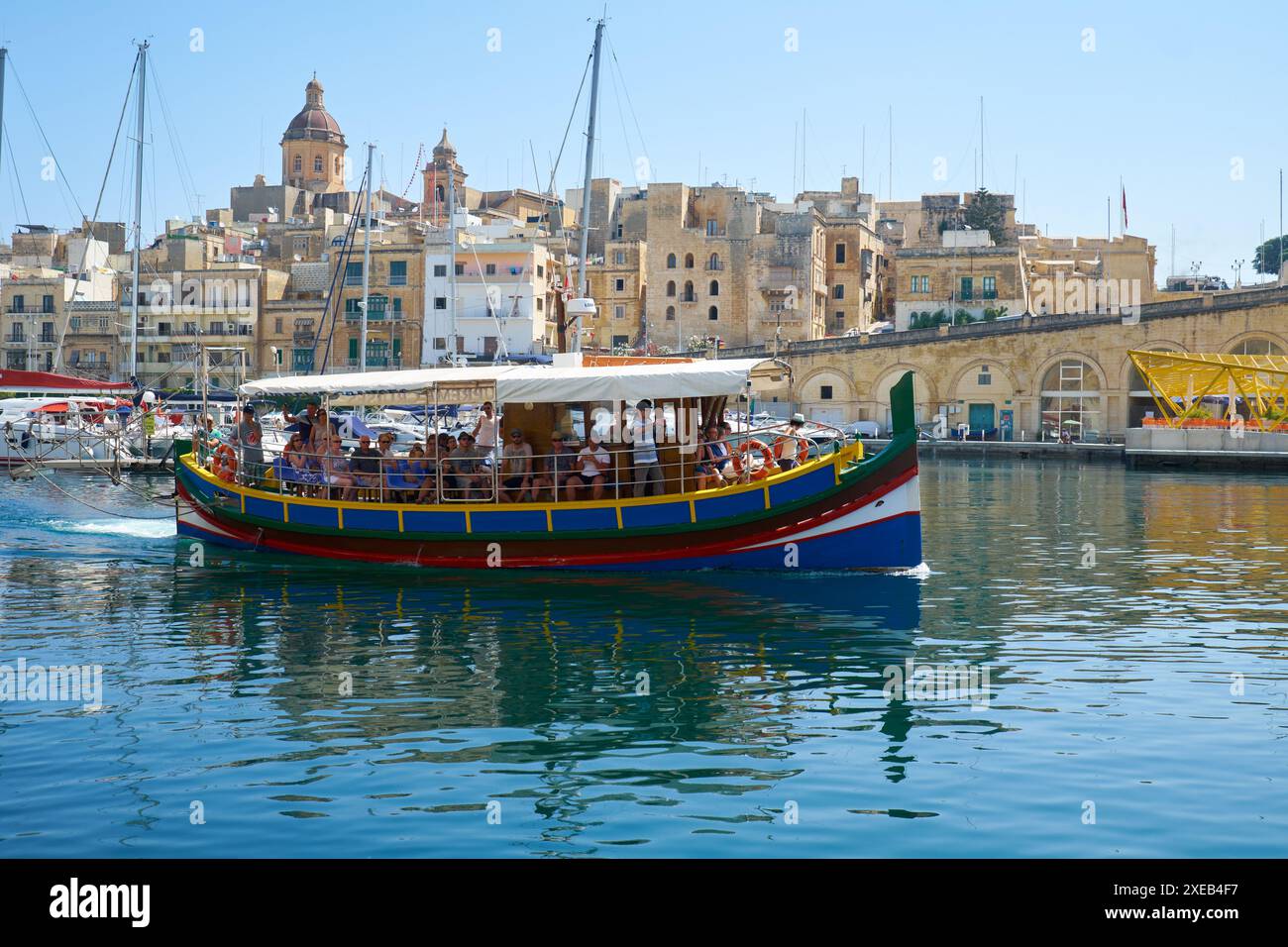 The view of traditional Maltese boat Luzzu in Dockyard bay on the ...