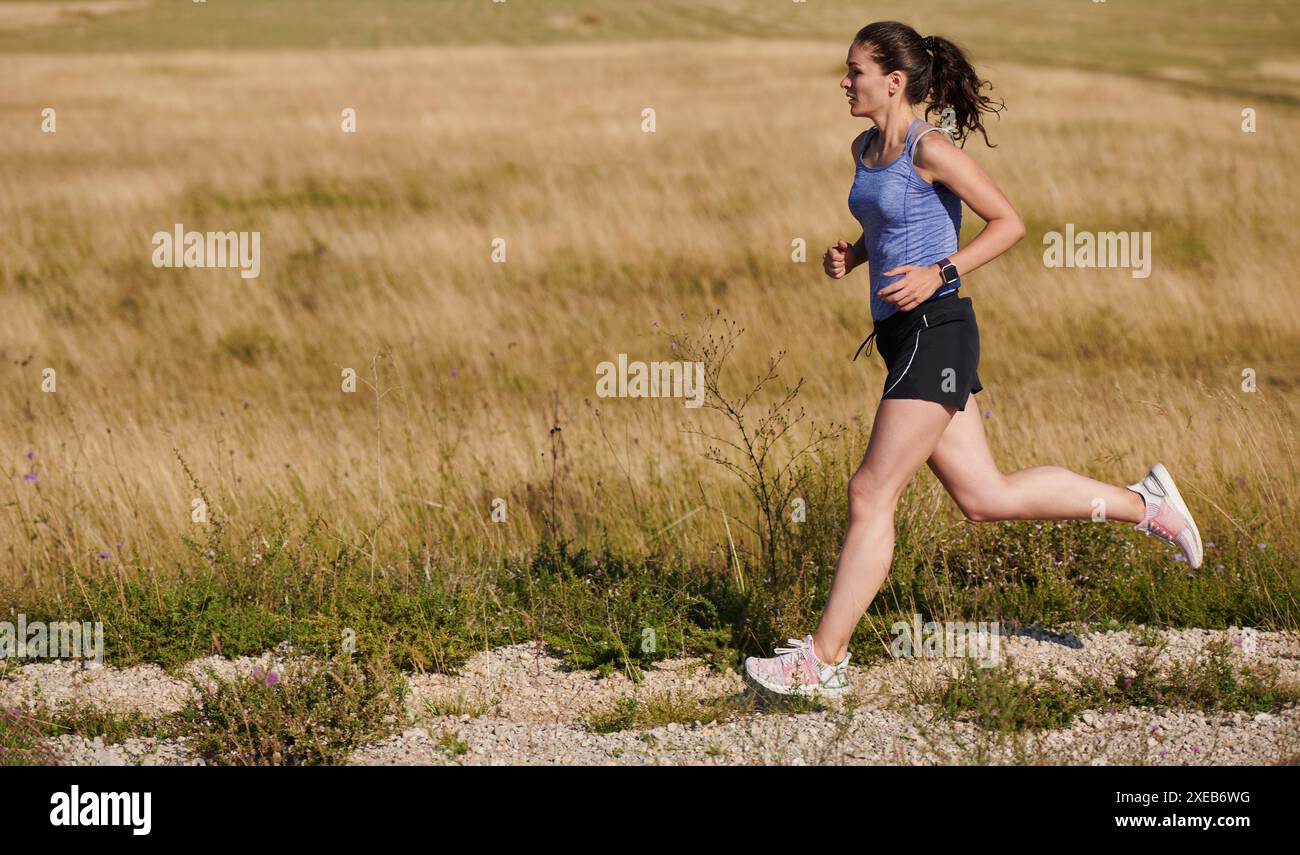 Solo Stride: Determined Athlete Woman Embarks on Fitness Journey for Marathon Preparation Stock ...