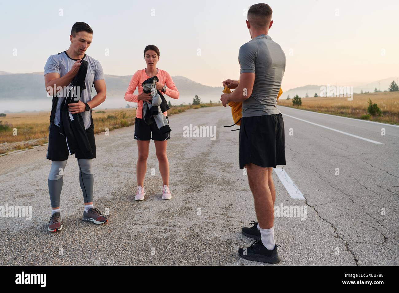 Morning Prep: Group of Athletes Getting Ready for a Run Stock Photo - Alamy