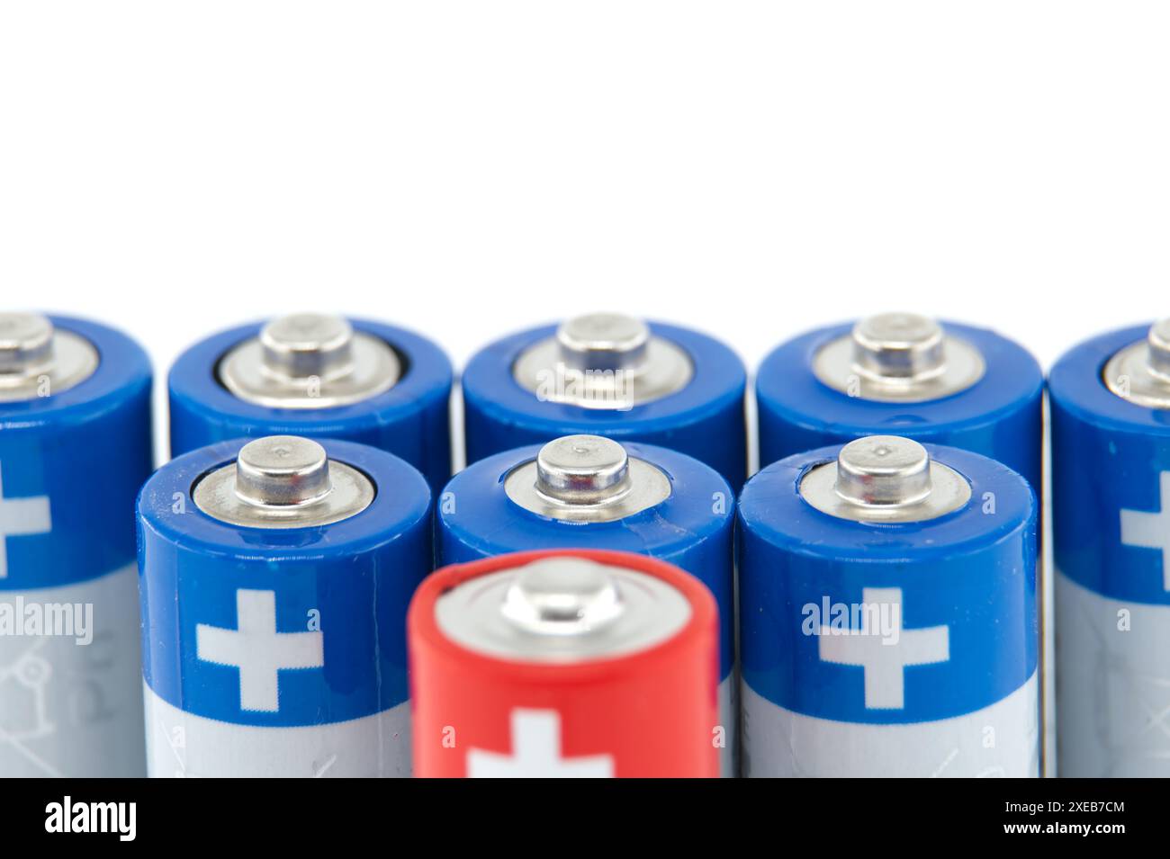 Close-up of AA batteries displaying the positive terminals, with a mix ...