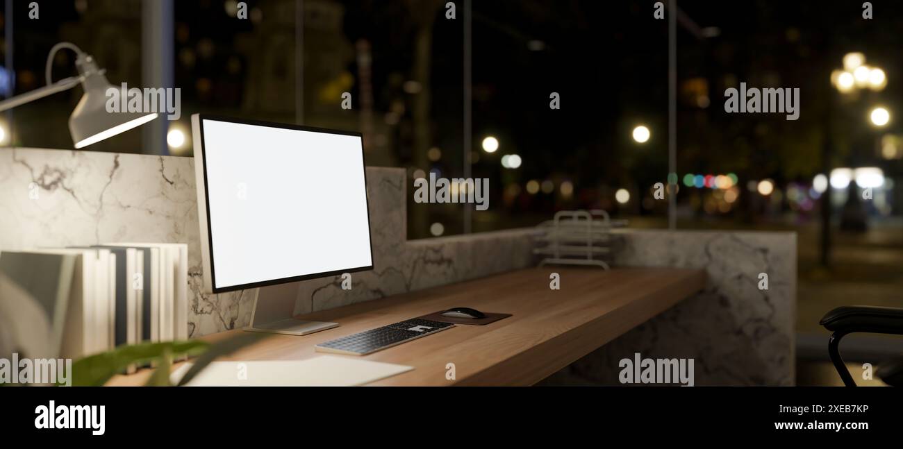 A computer with a white-screen mockup on a lobby reception counter at ...