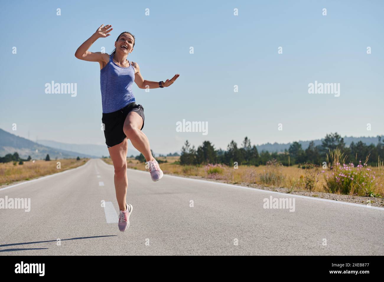 Leap of Victory: Athlete Symbolizes Success and Dedication Through Mid ...