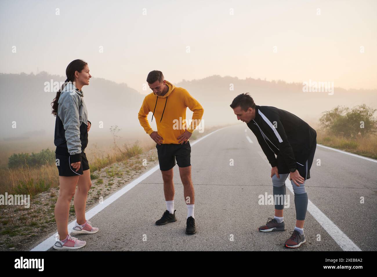Diverse Athletic Warm-Up: Group Prepares for Intense Running Challenge ...