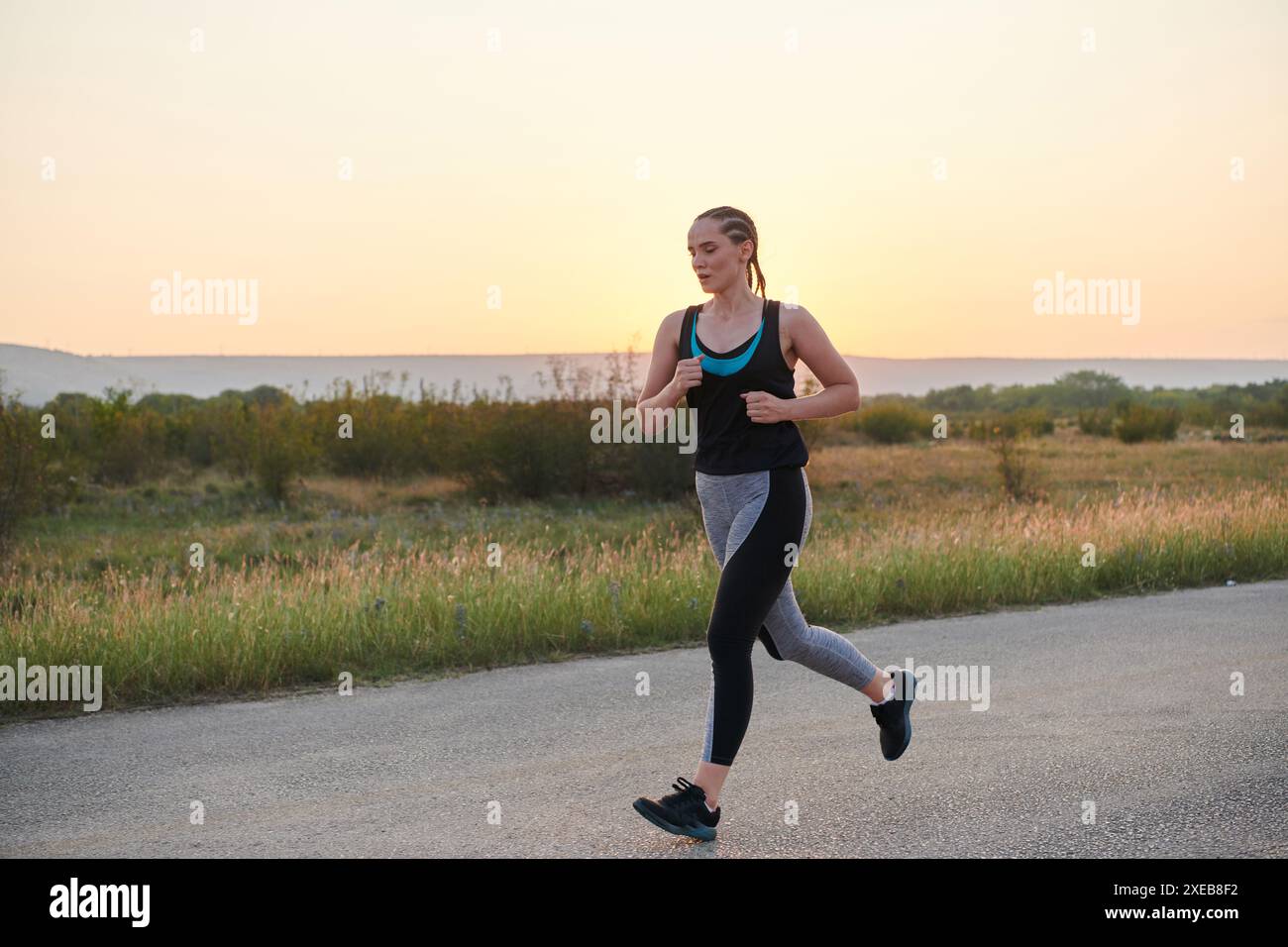 Solo Stride: Determined Athlete Woman Embarks on Fitness Journey for Marathon Preparation Stock ...