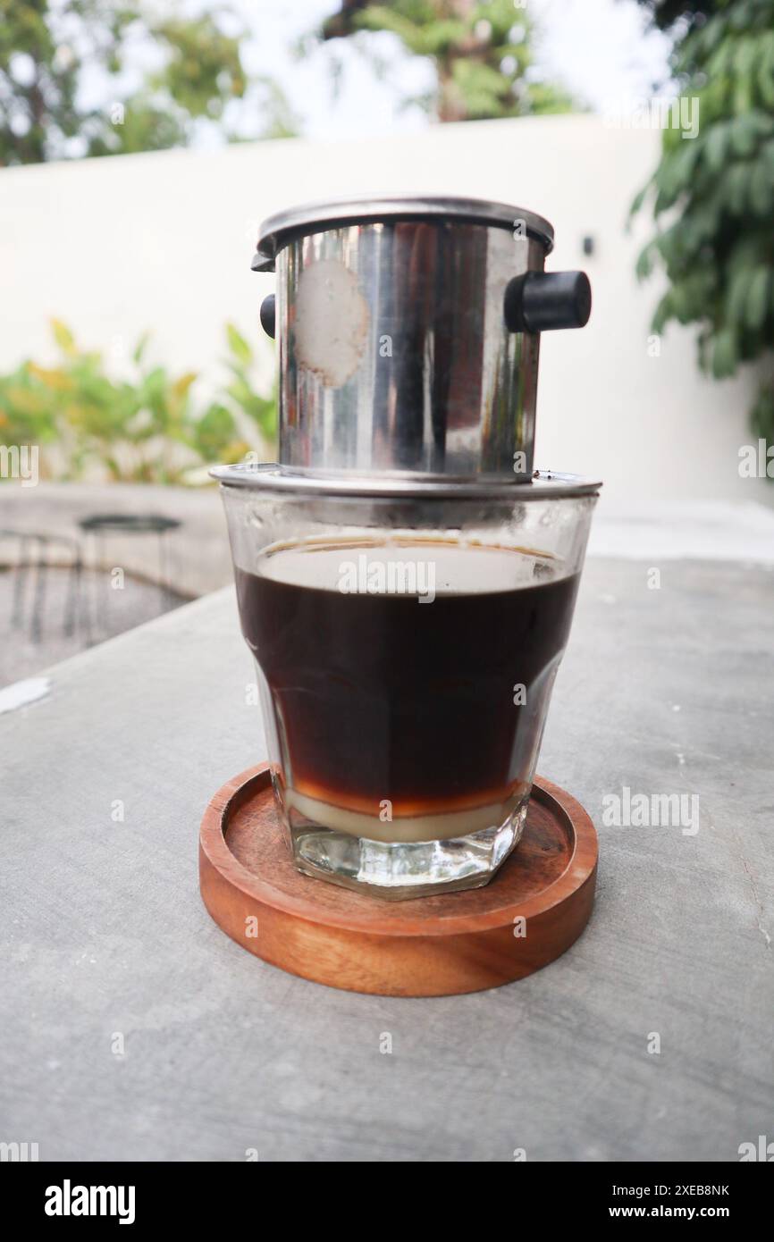 Vietnamese drip, Vietnamese coffee with condensed milk in glass cups ...