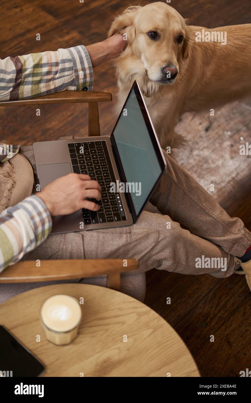 Vertical cropped picture of male hands typing on keyboard, using laptop ...