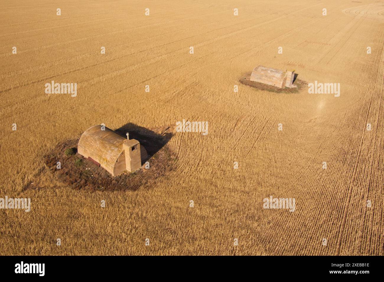 Aerial of concrete bunkers know as Igloos constructed in a wheat field ...