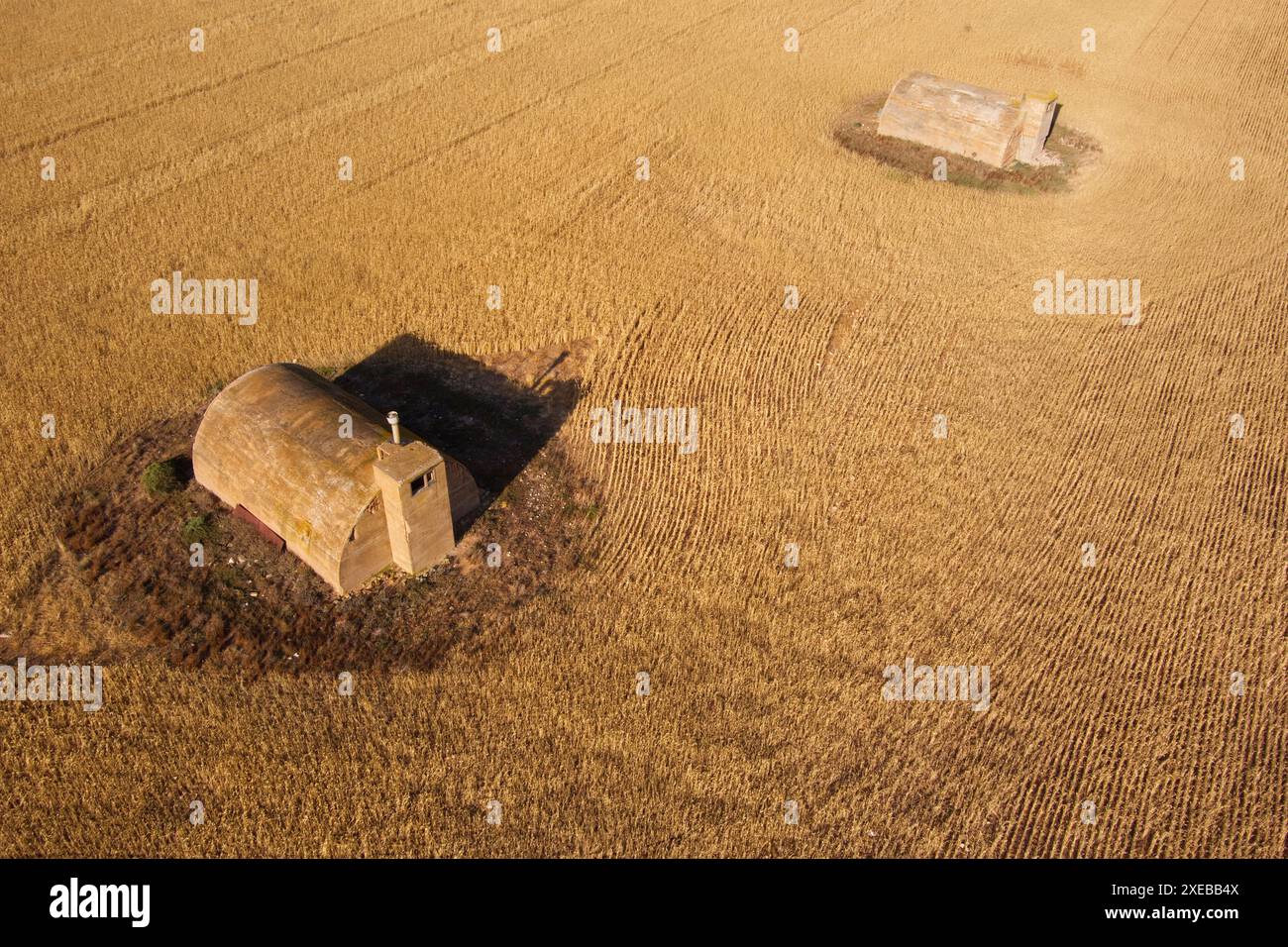 Aerial of concrete bunkers know as Igloos constructed in a wheat field ...