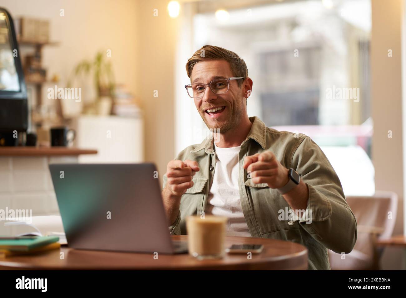 Portrait man pointing inviting sitting hi-res stock photography and ...