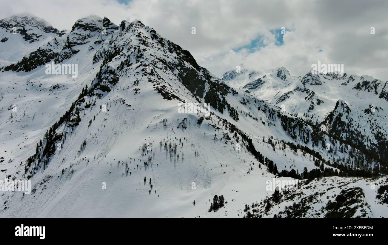Flying over cold snowy mountain hi-res stock photography and images - Alamy