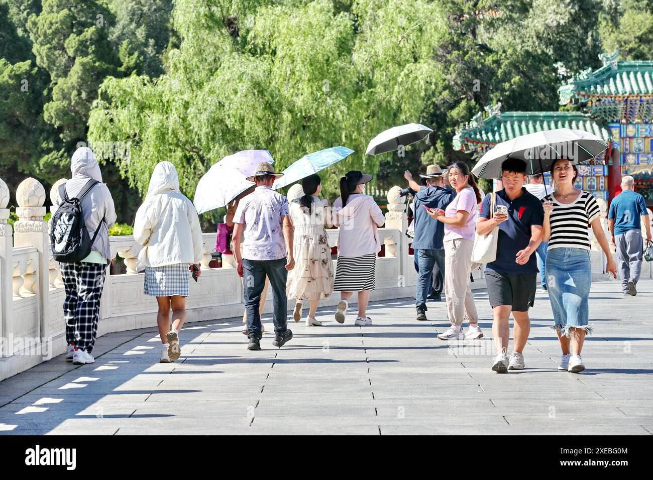 Tourists visit the Beihai Park amid hot weather in Beijing, China, 24 ...