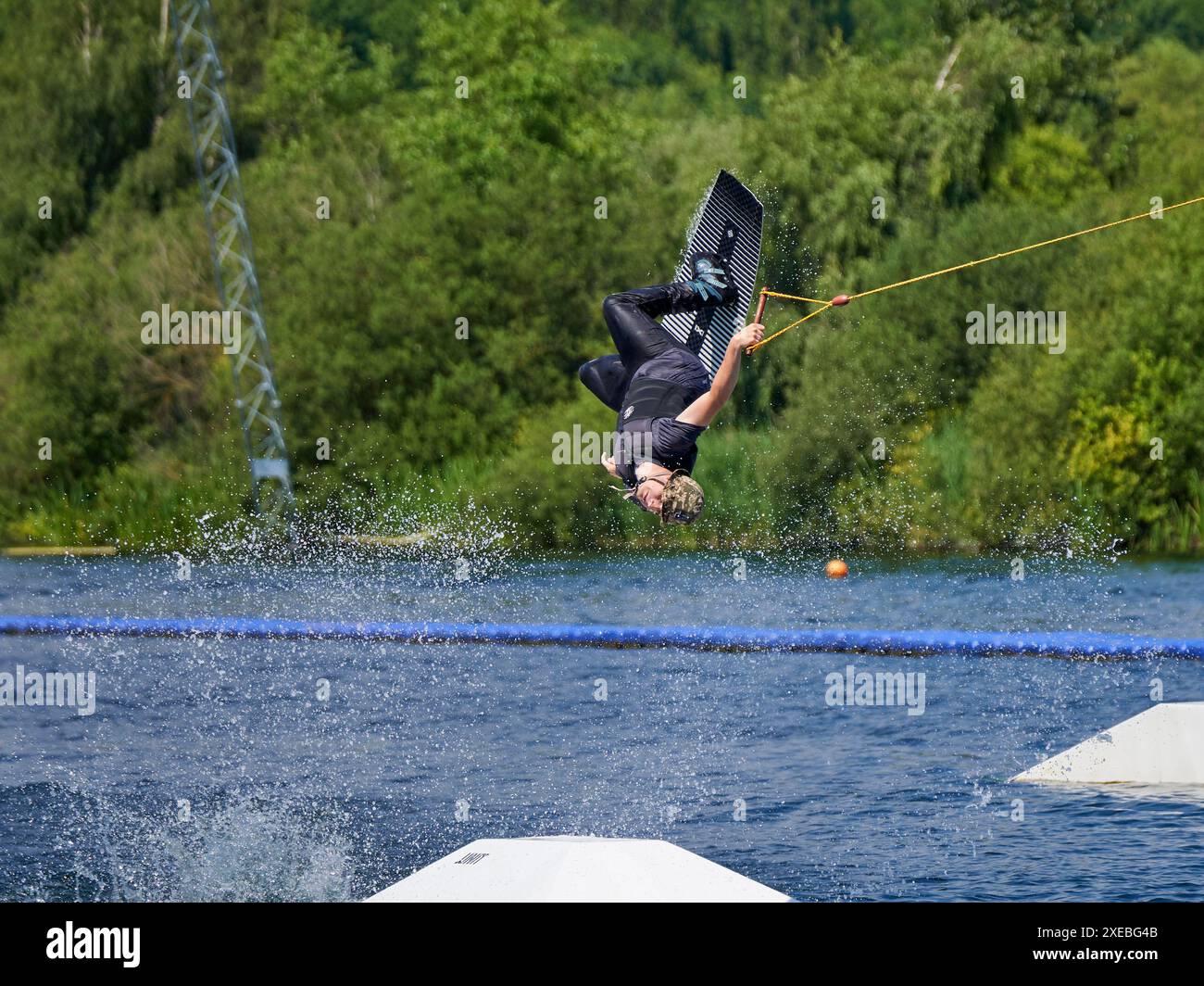 Man performing wake board tricks at Spring Lakes, Long Eaton ...