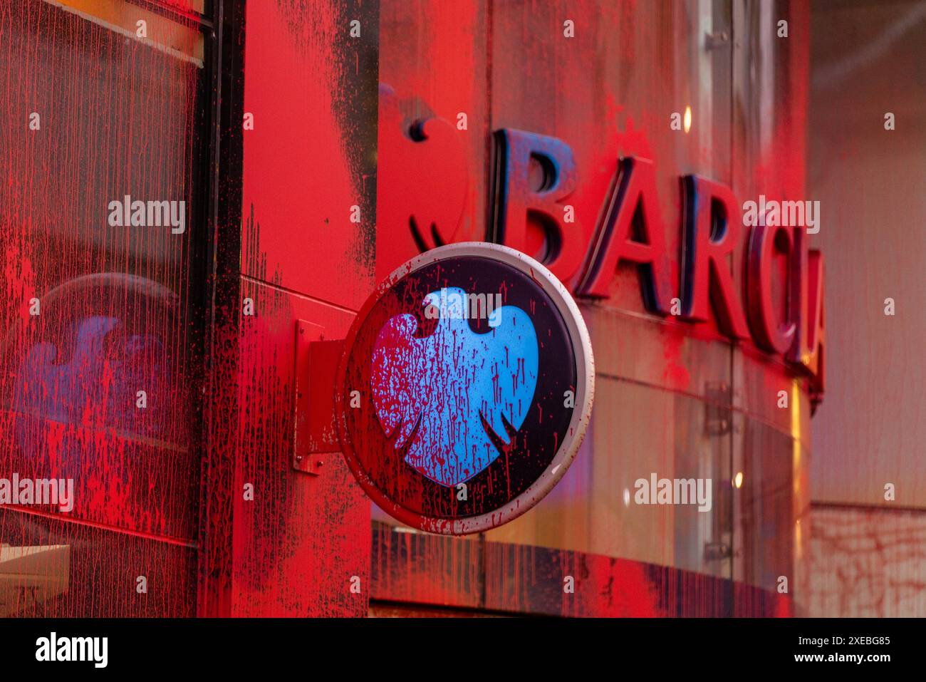Leeds, UK. 27 JUN, 2024. Barclays logo covered in paint as direct ...