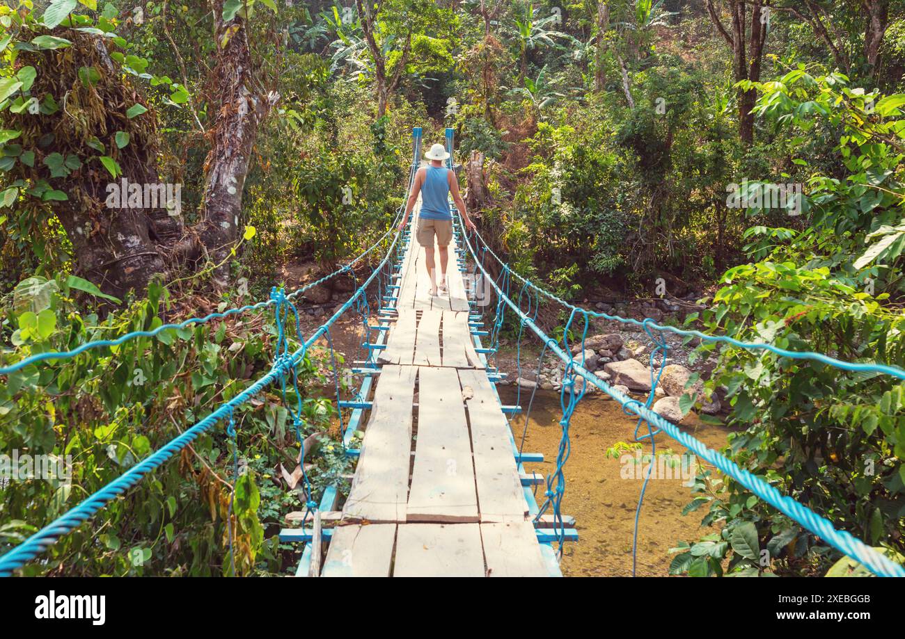 Tourist crossing wooden suspended bridge hi-res stock photography and ...
