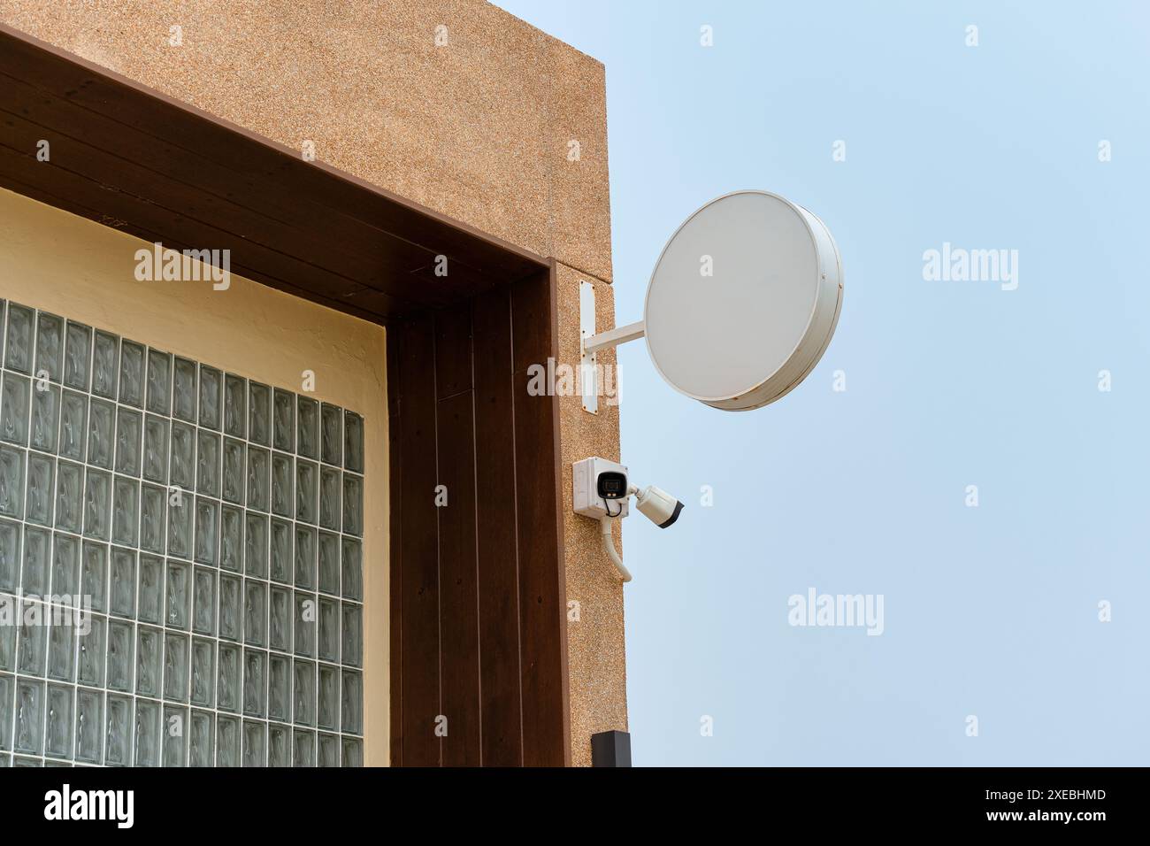 Empty shop sign and CCTV camera hanging on corner building of cafe ...