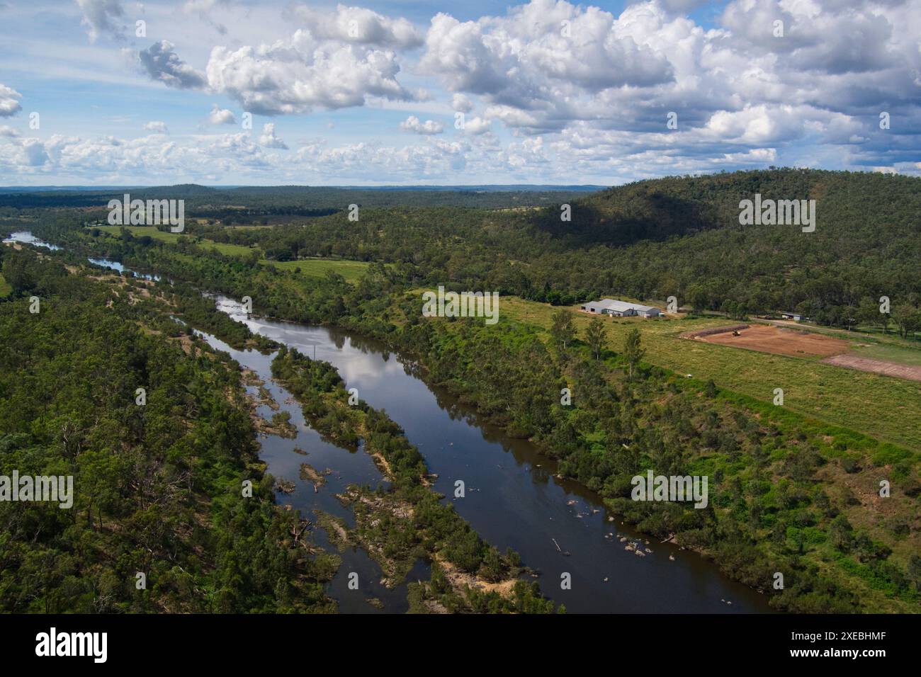 Aerial of farm set on the banks of the Burnett River just below the ...