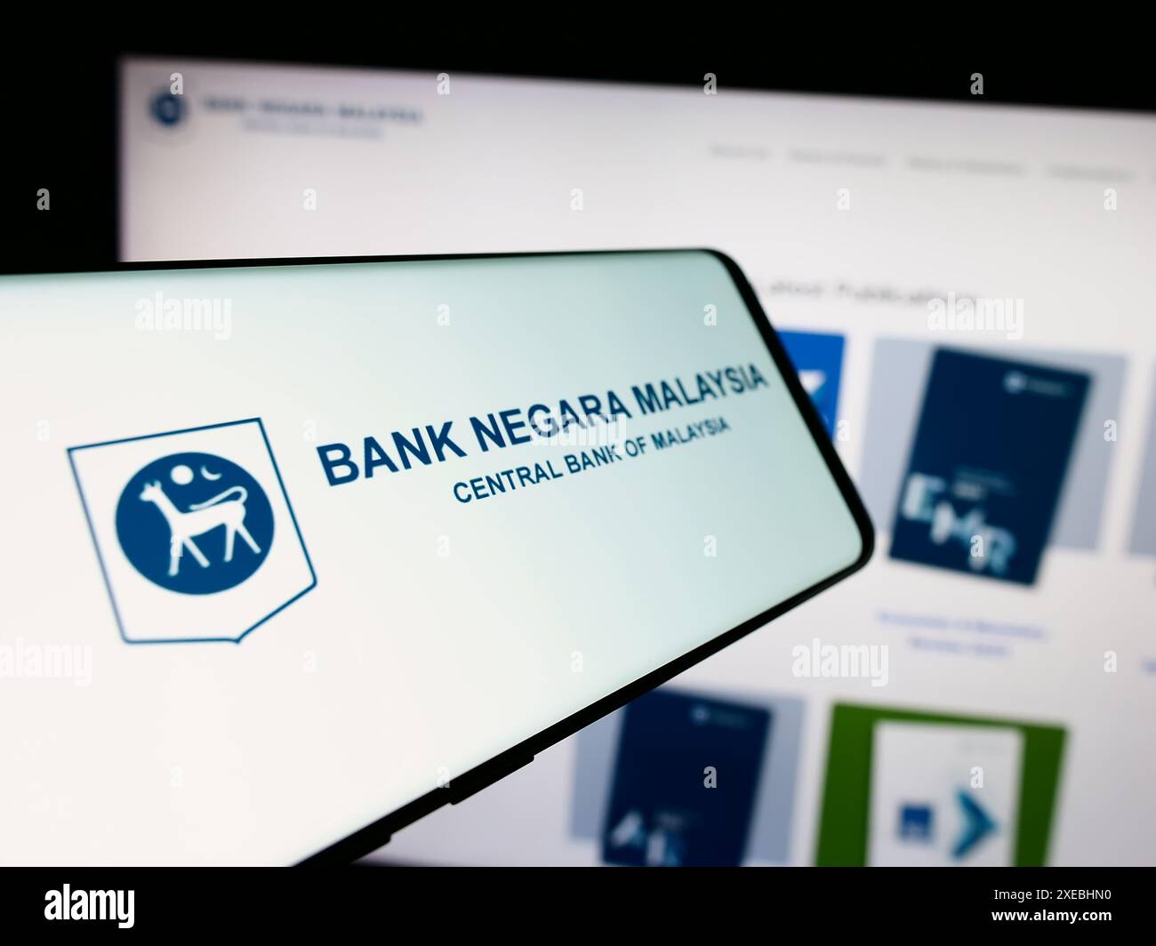 Smartphone with logo of Malaysian institution Bank Negara Malaysia (BNM) in front of website ...