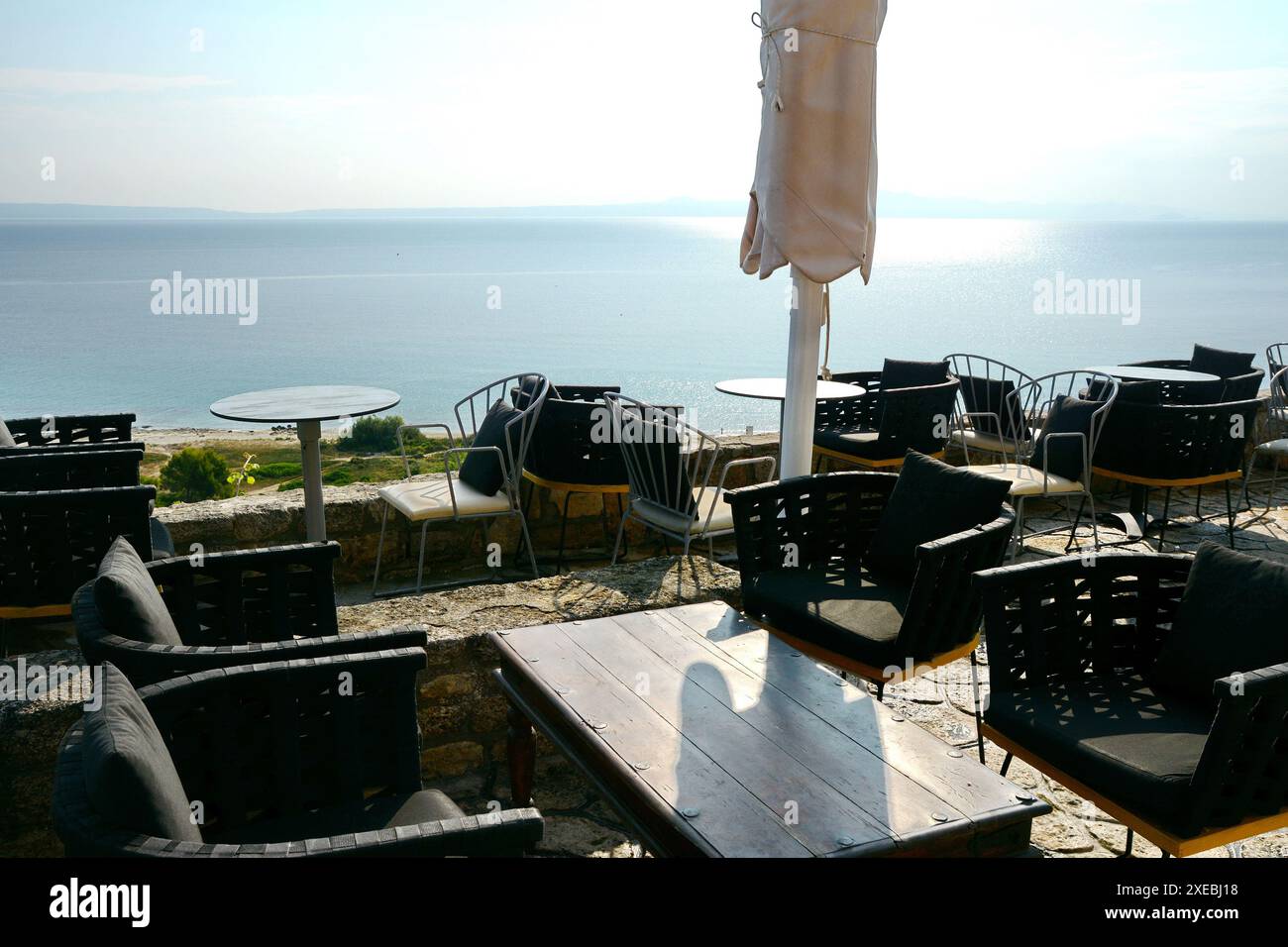Restaurant by the sea before sunset Stock Photo - Alamy