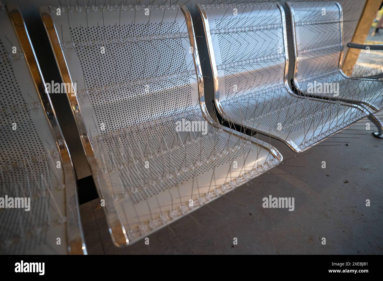 Anti-bird spikes are fitted to airport benches at the new re-purposed ...
