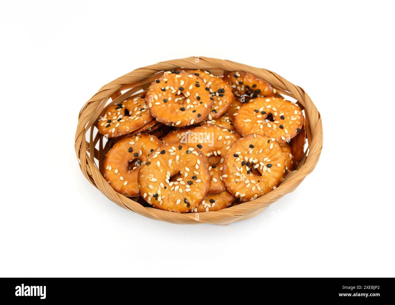 Salted round pretzels with black and white sesame isolated on white ...