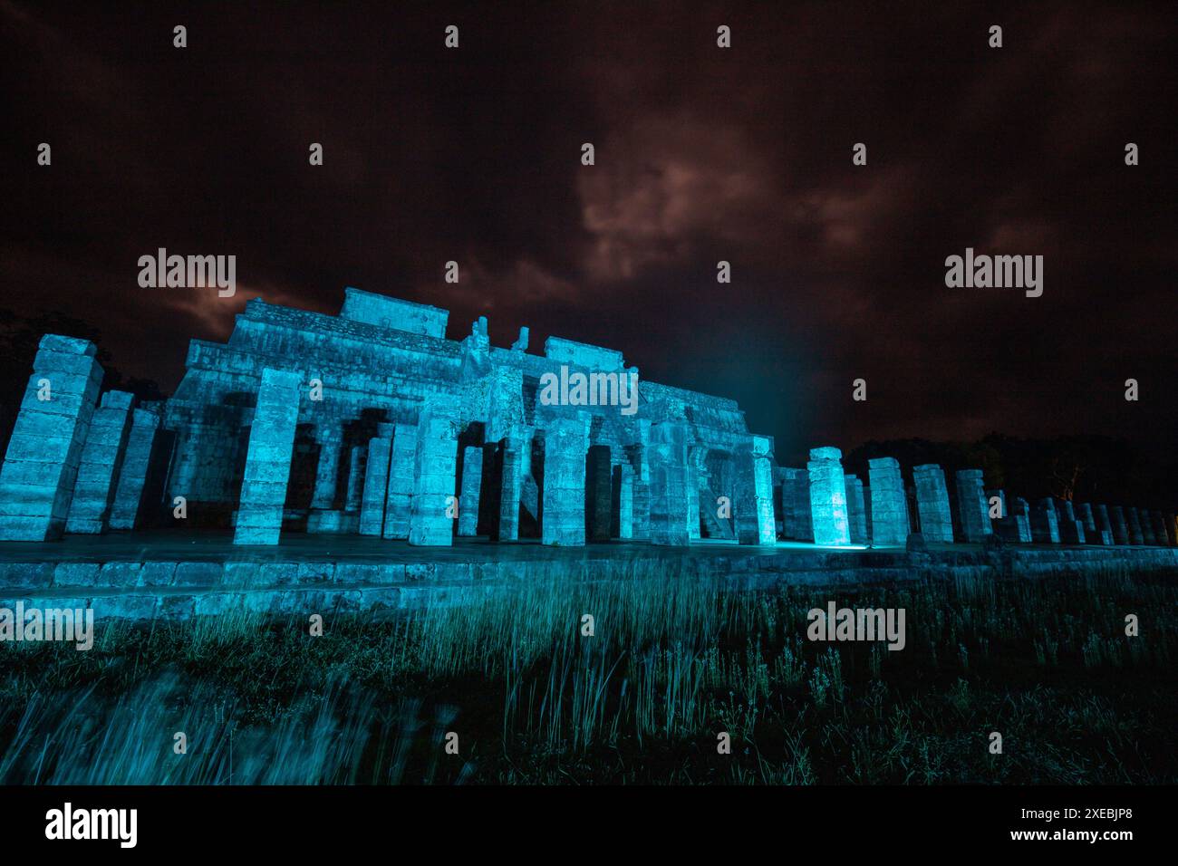Chichen Itza archaeological site with blue lights at night, Yucatan ...