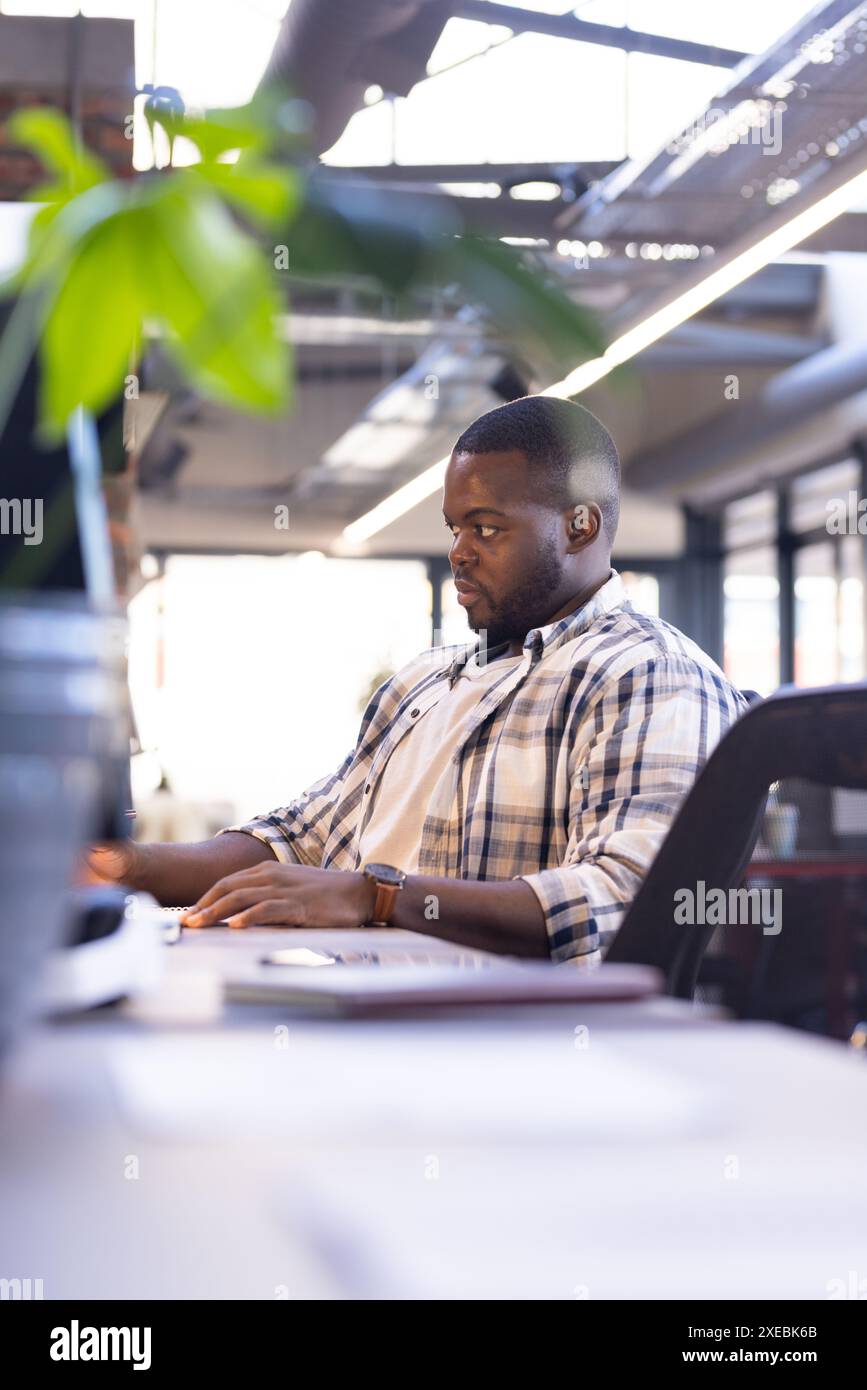 Working in office, business man typing on laptop, focusing on work ...
