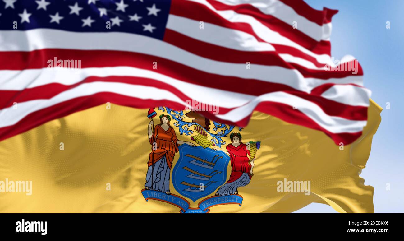 New Jersey state flags waving with the american flag on a clear day ...
