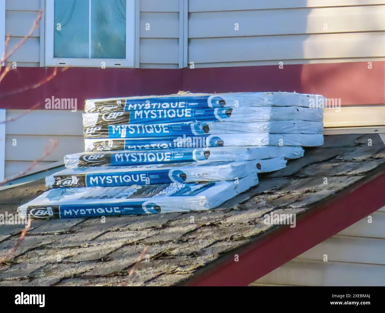 Multiple bundles of Tone Black Fiberglass Roofing Shingles positioned ...