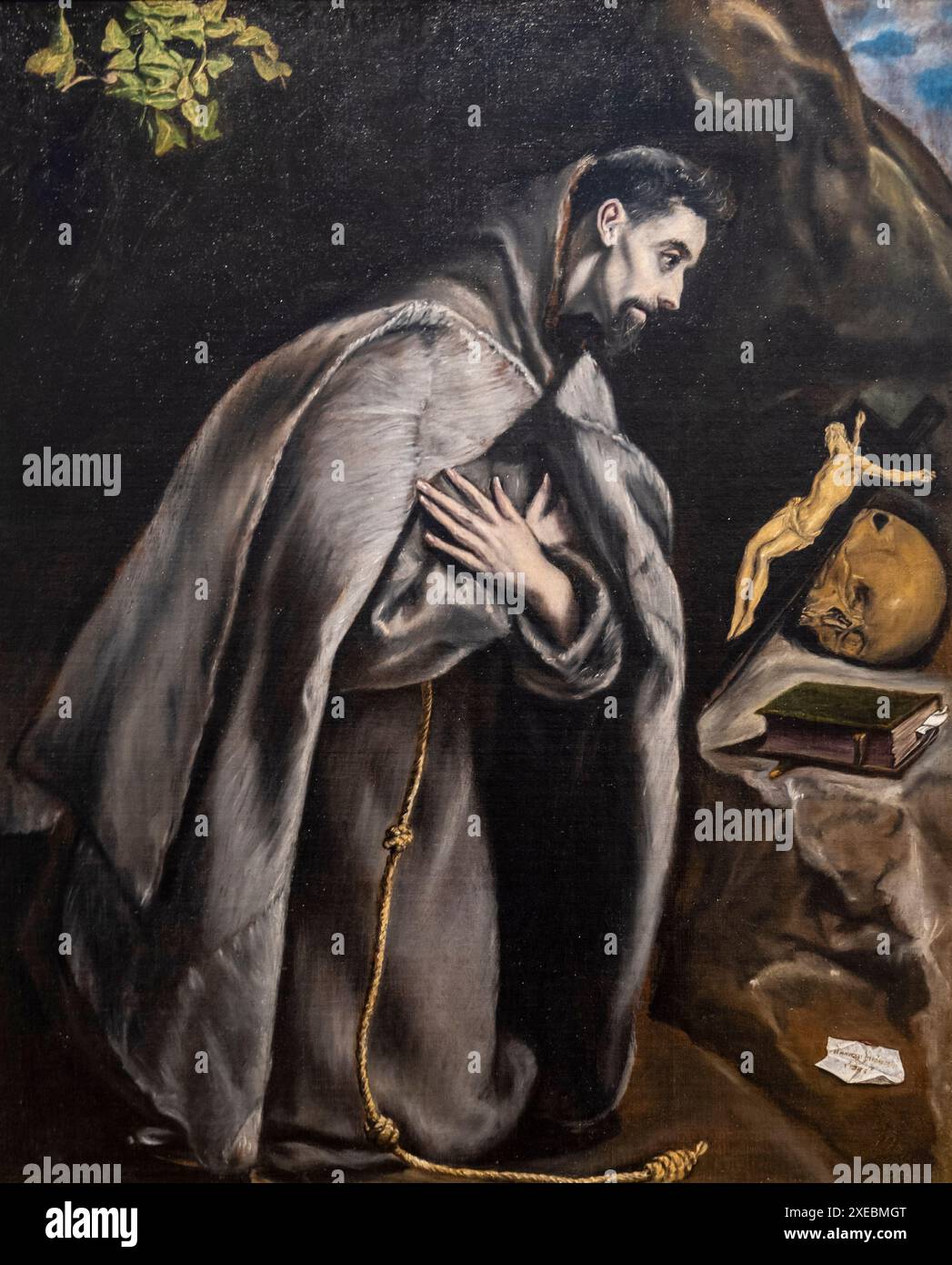 Saint Francis in prayer before the Crucifix Stock Photo - Alamy