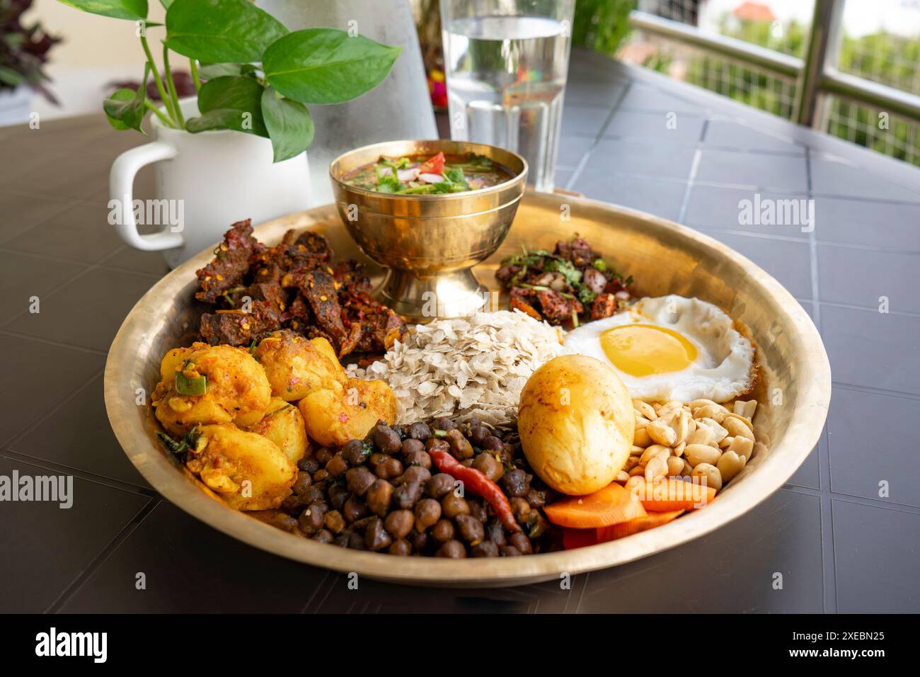 Newari Khaja Set Typical Nepali Thali with Rice Flakes, Choyila, Eggs ...