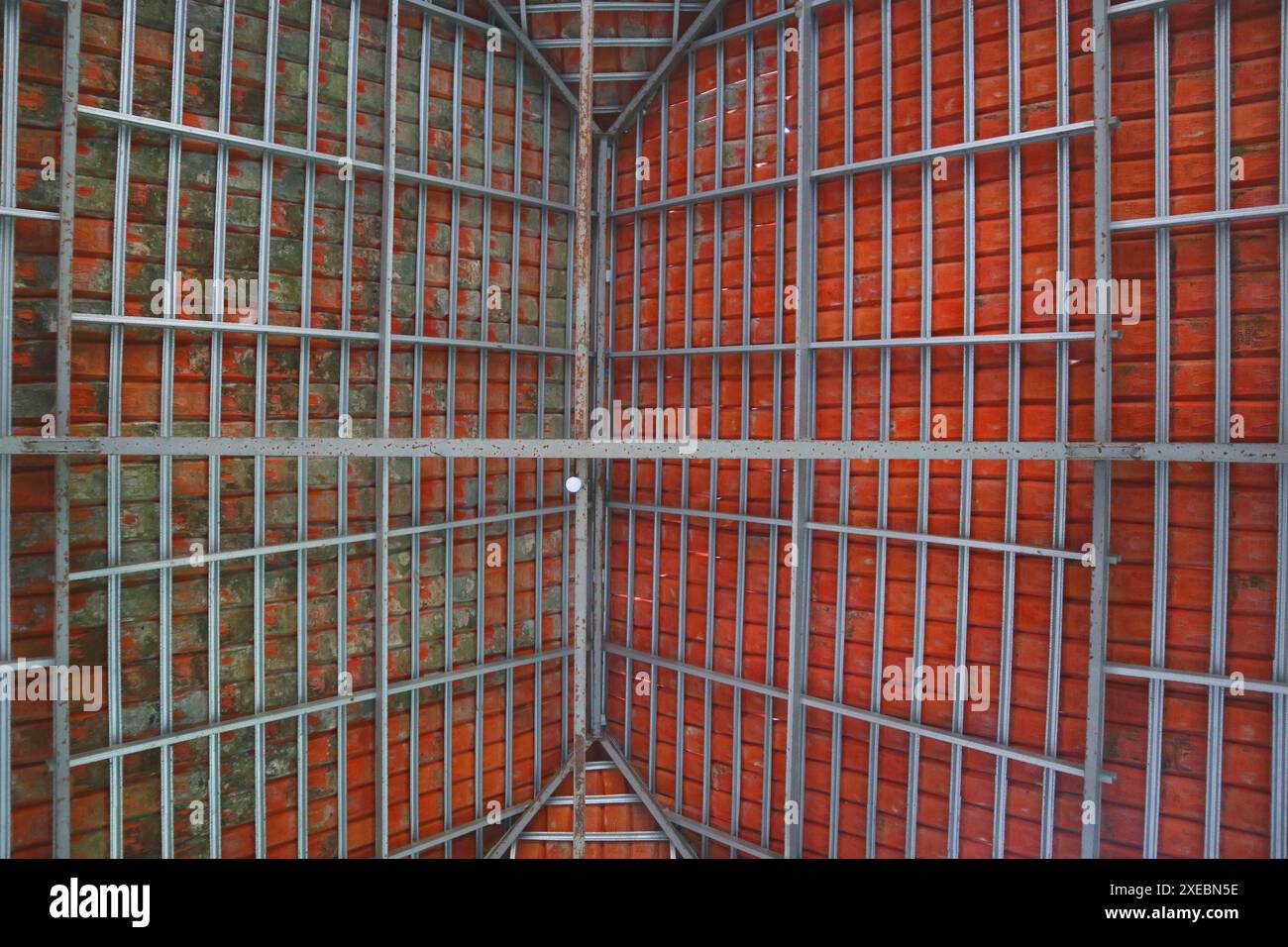 Roof construction photographed from below, composed of tiles and hollow ...