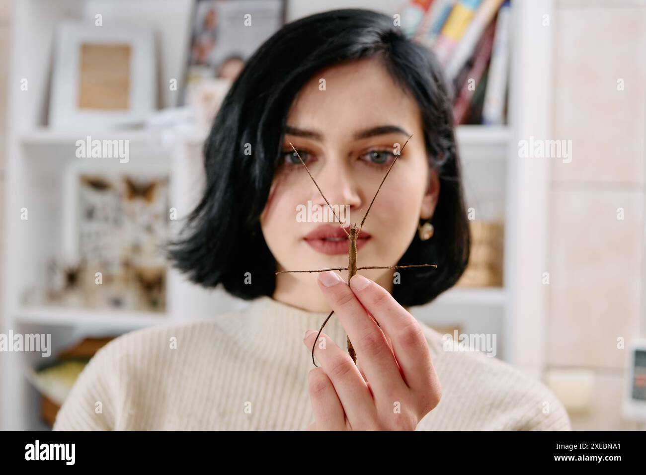 Young Woman Captured in a Beautiful Moment with Her Stick Insect ...