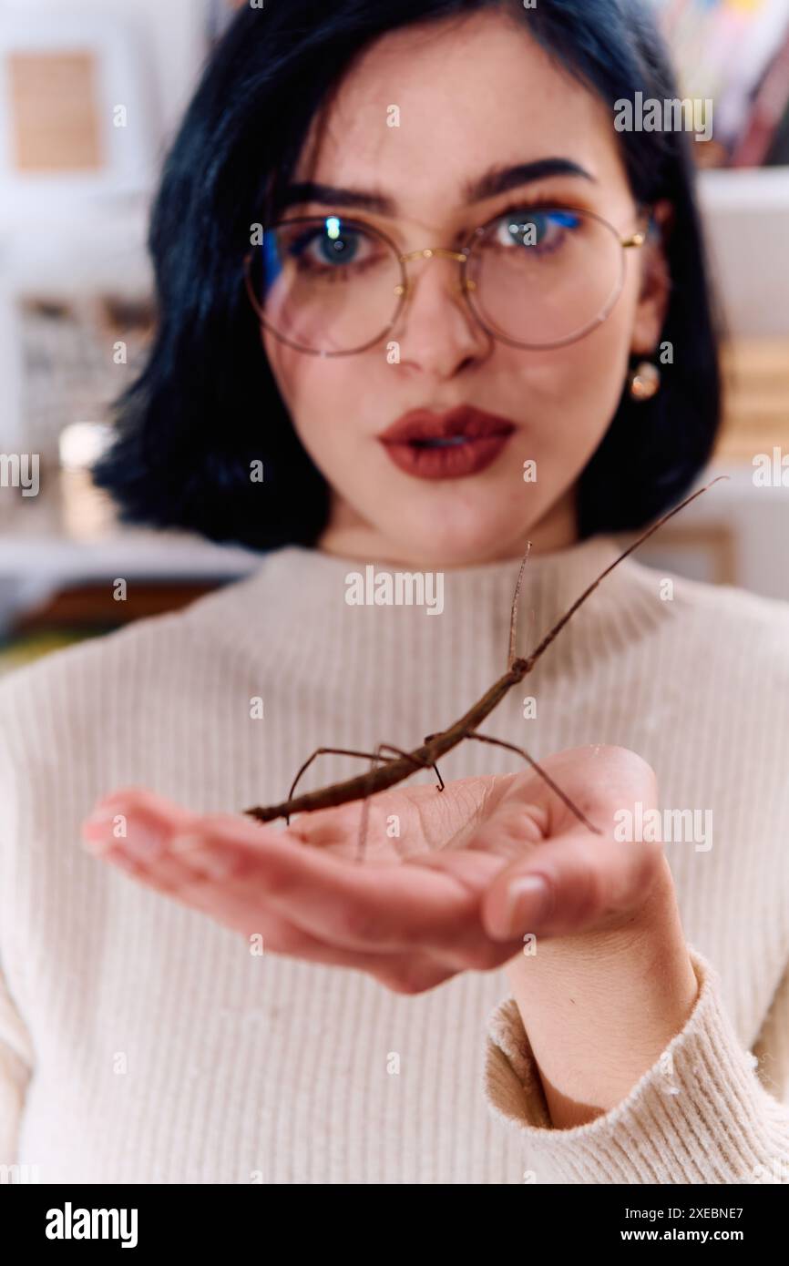 Young Woman Captured in a Beautiful Moment with Her Stick Insect ...
