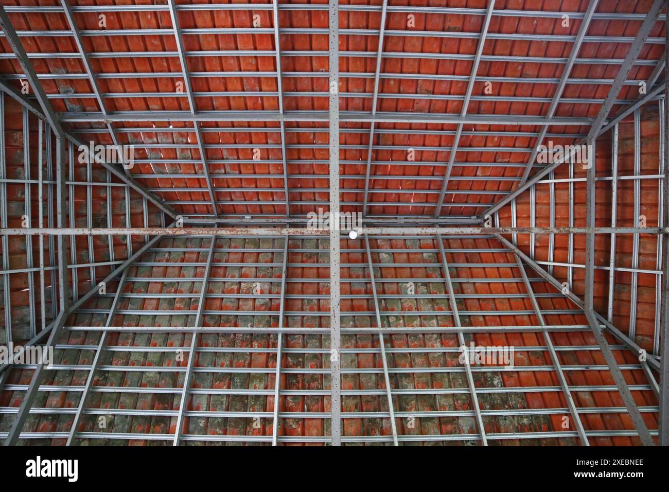 Roof construction photographed from below, composed of tiles and hollow ...