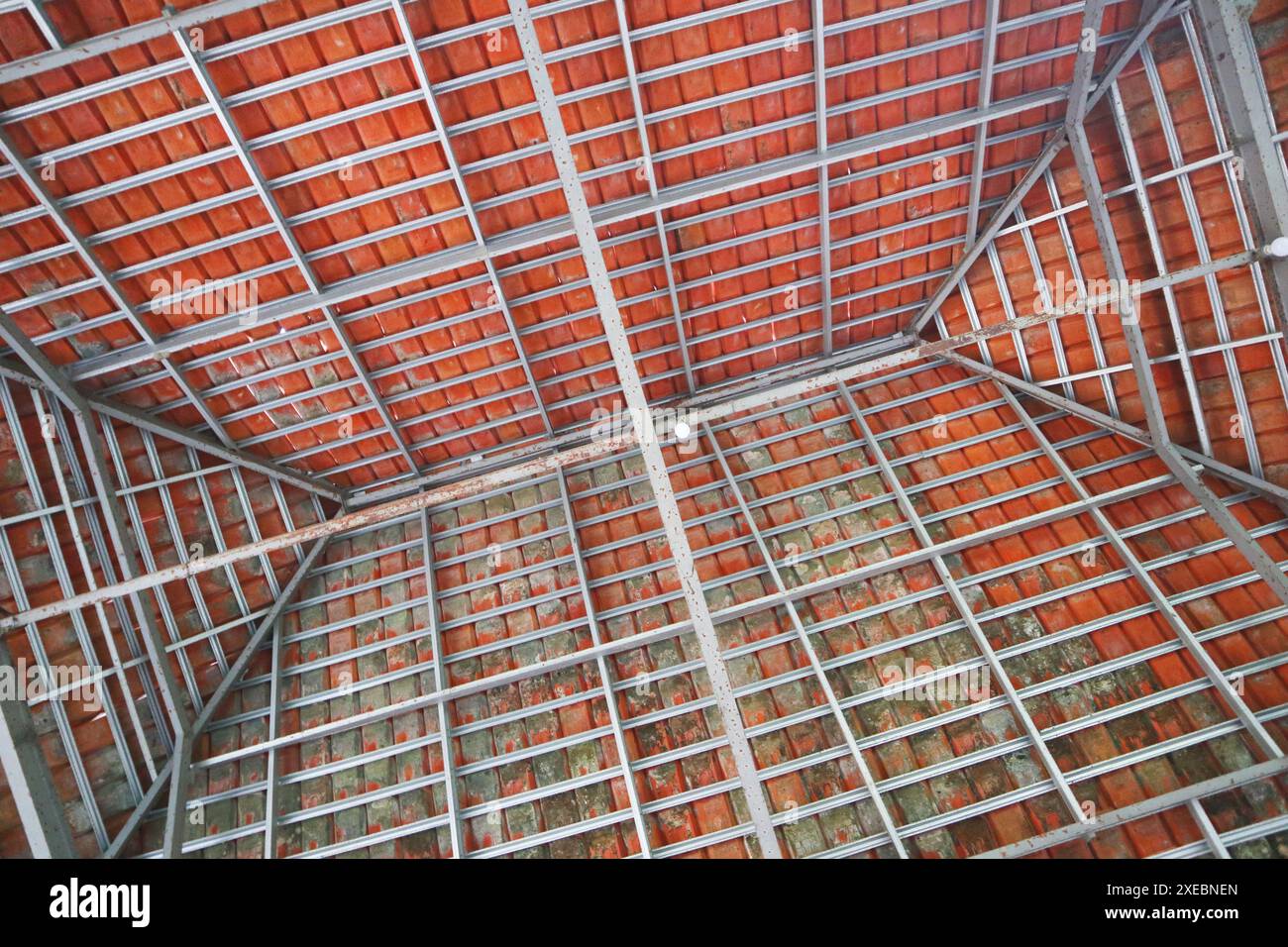 Roof construction photographed from below, composed of tiles and hollow ...