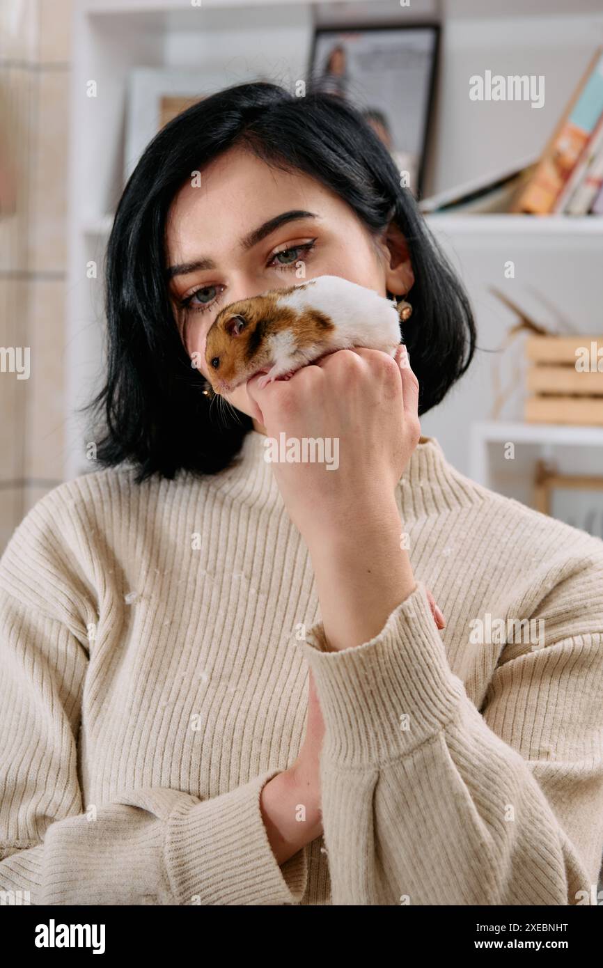 A Black-Haired Beauty Enjoys a Cozy Day at Home with Her Pet Mouse ...