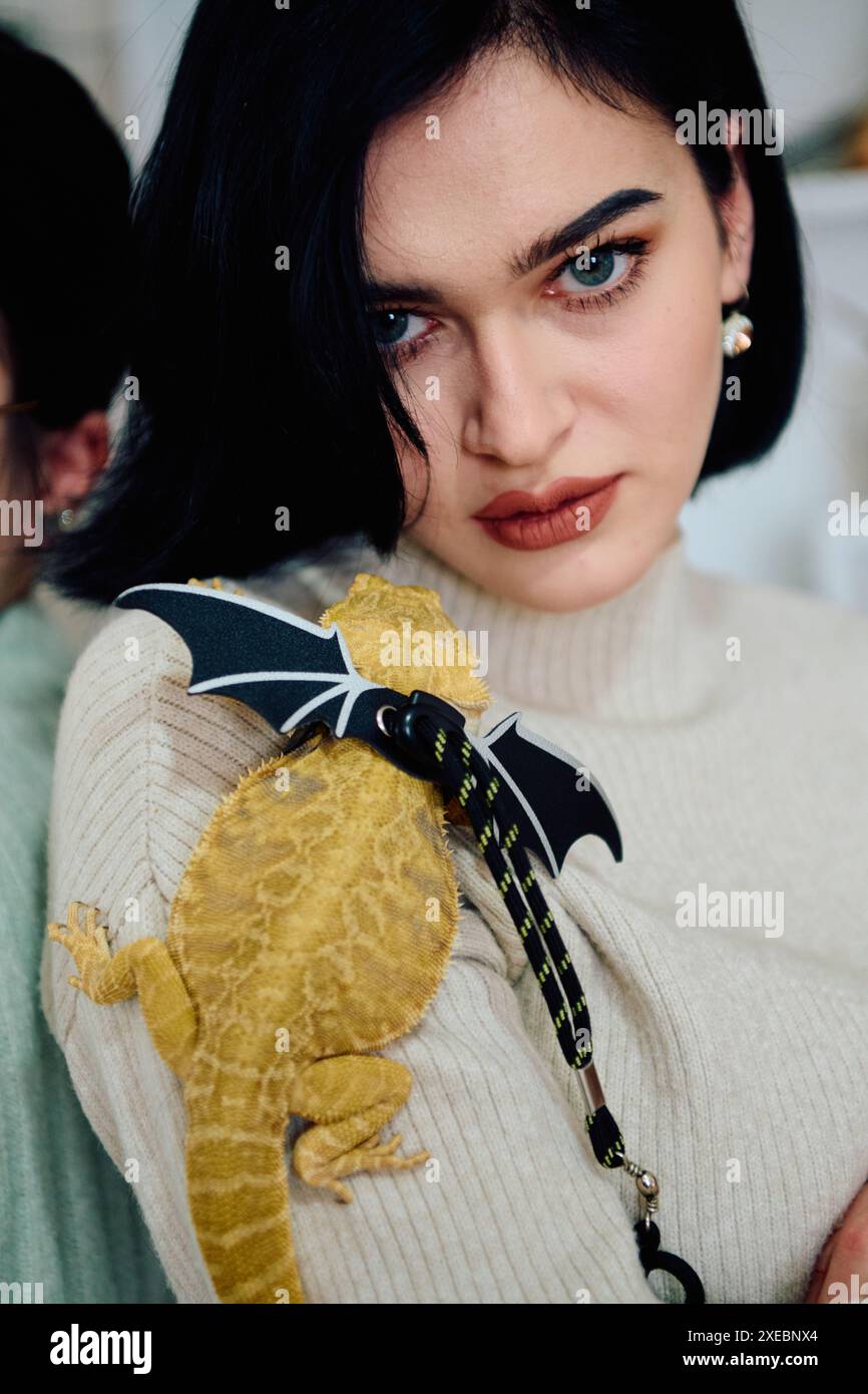 Sisters and Their Bearded Dragon: A Family Portrait Stock Photo - Alamy