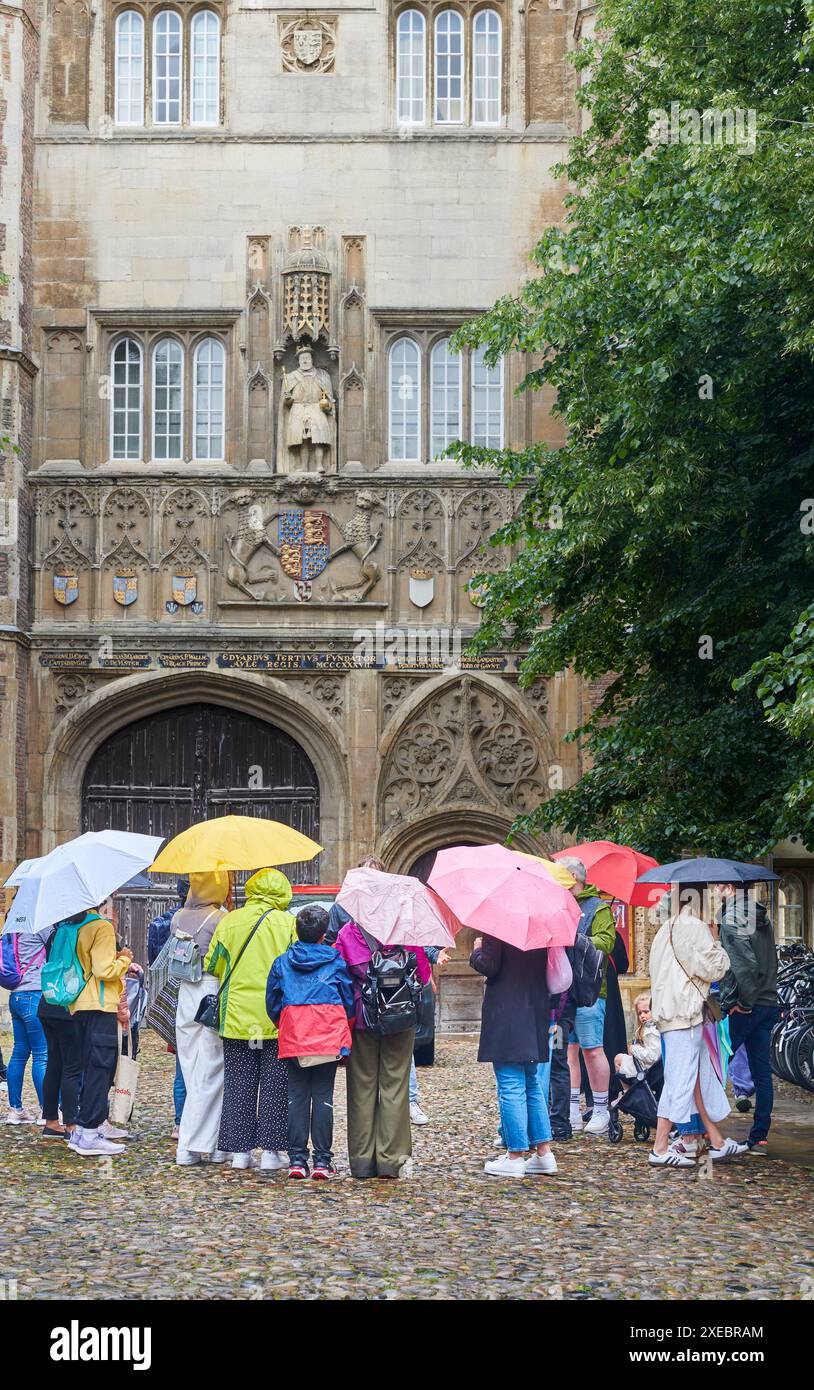 Chinese tourists with umbrellas outside the main entrance to Trinity ...