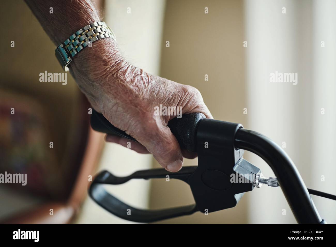 Elderly person, hands and walker for support or retirement in home with ...