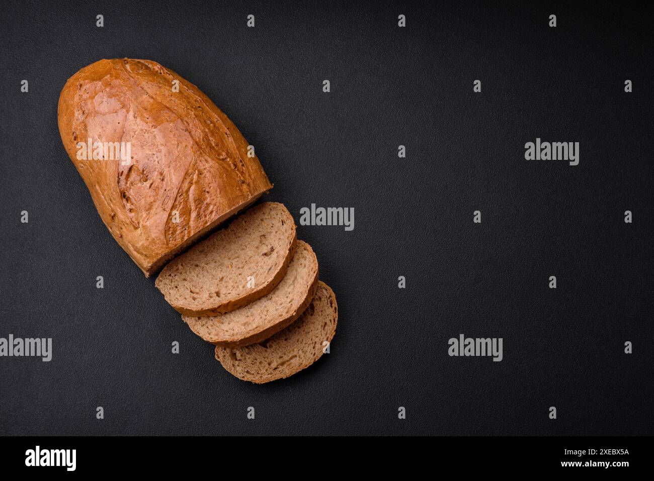Delicious fresh crispy loaf of white bread with grains and seeds Stock ...