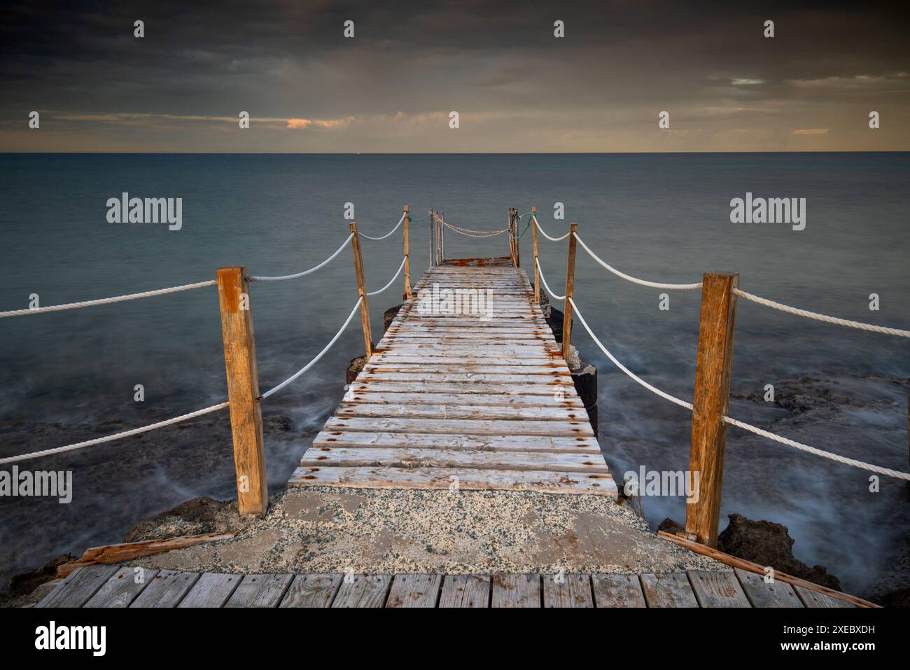 Wooden pier in sea sunset hi-res stock photography and images - Alamy