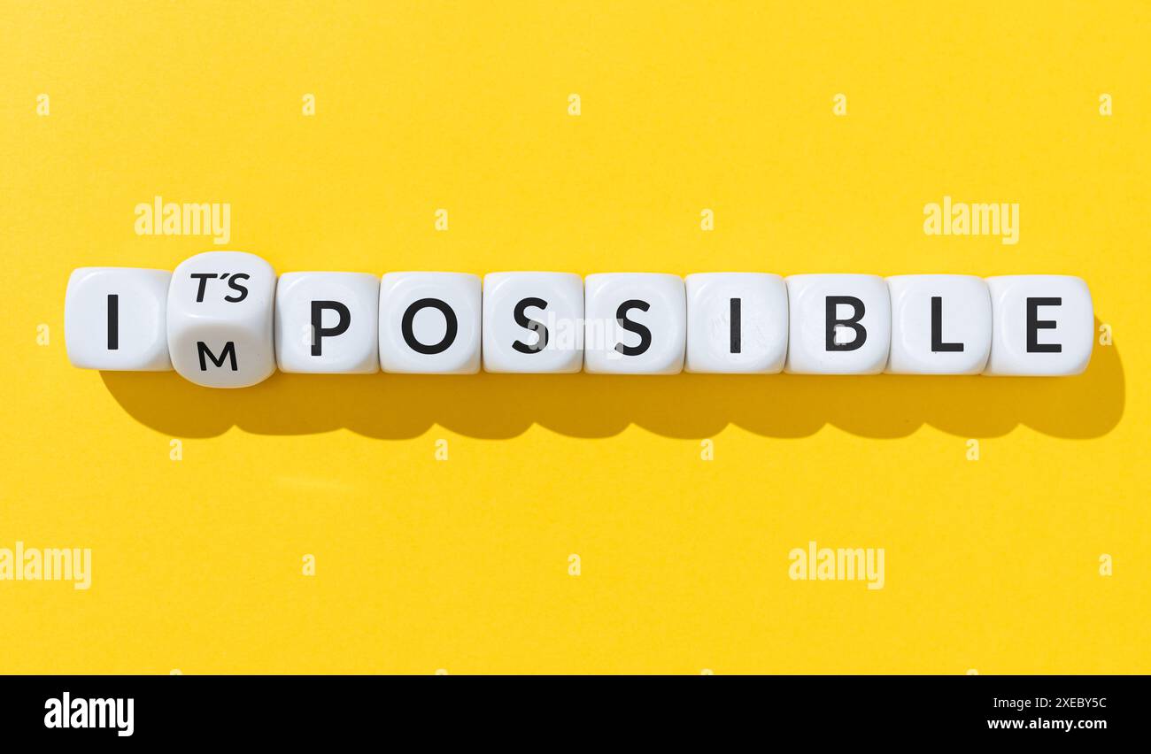 Changing word impossible into it is possible. Cube blocks with text ...